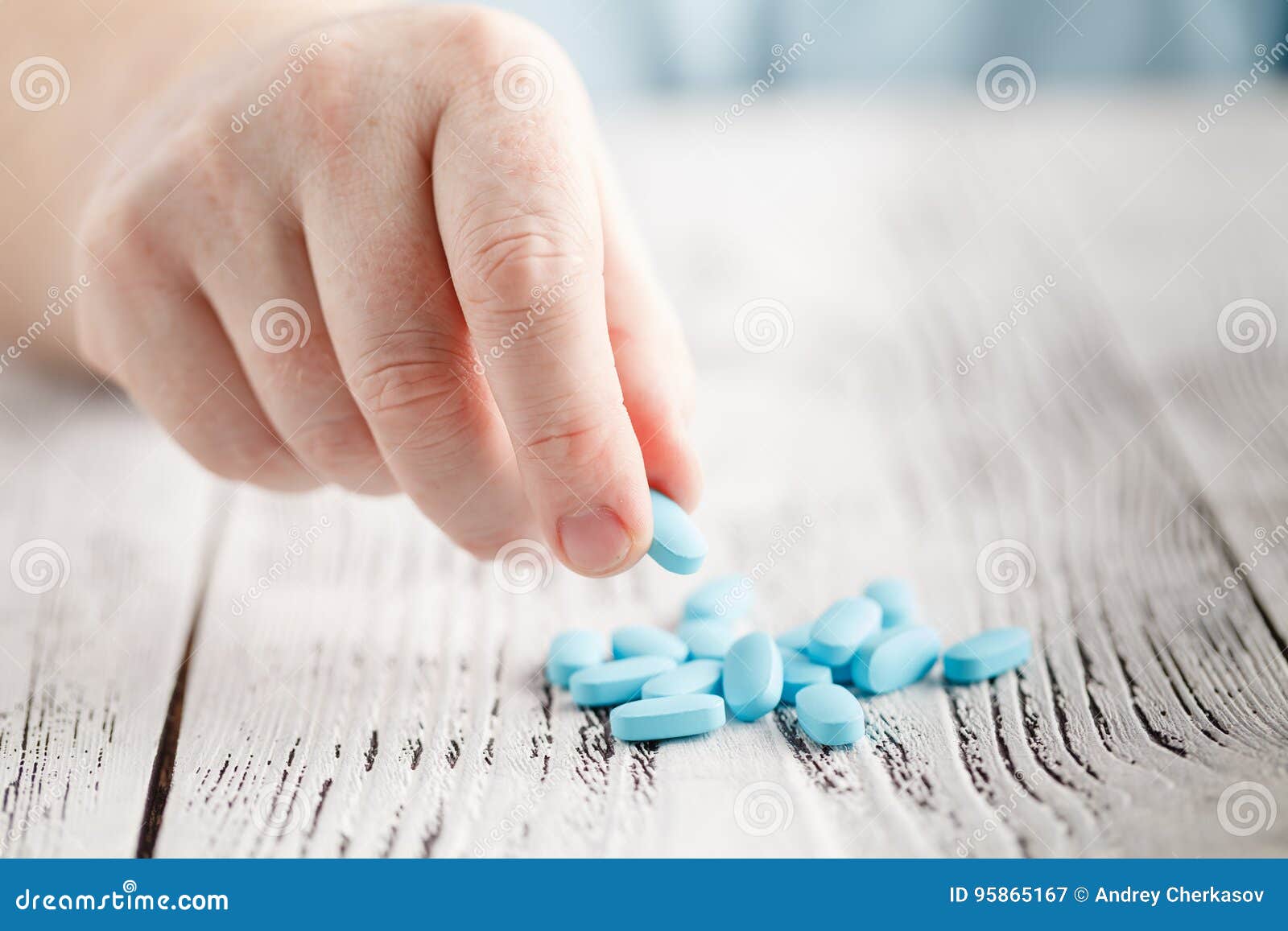 Male Hand Holding Blue Pill between Fingers Stock Image - Image of ...