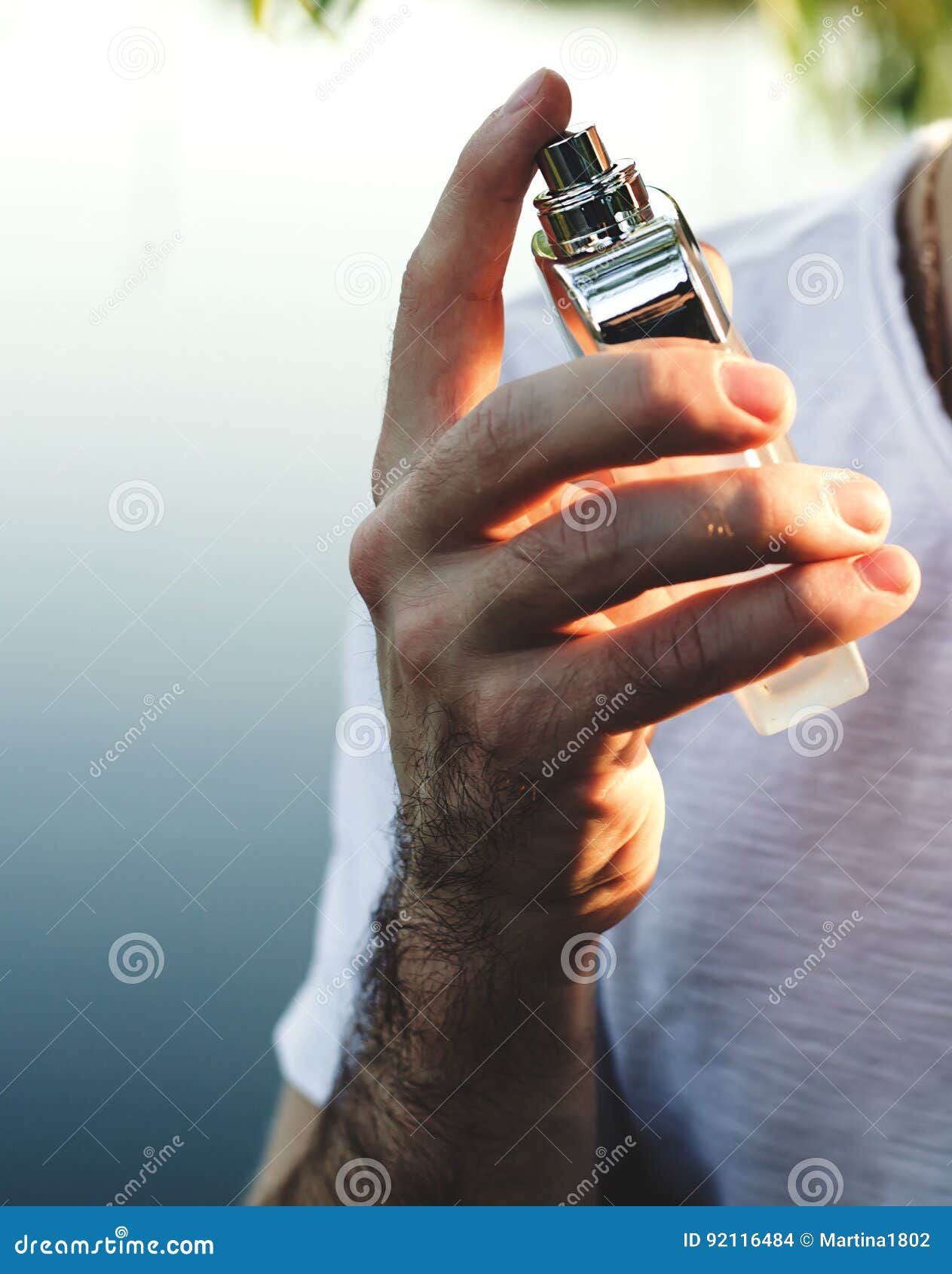 Male Hand Holding Bottle of Perfume Stock Photo - Image of flavor ...