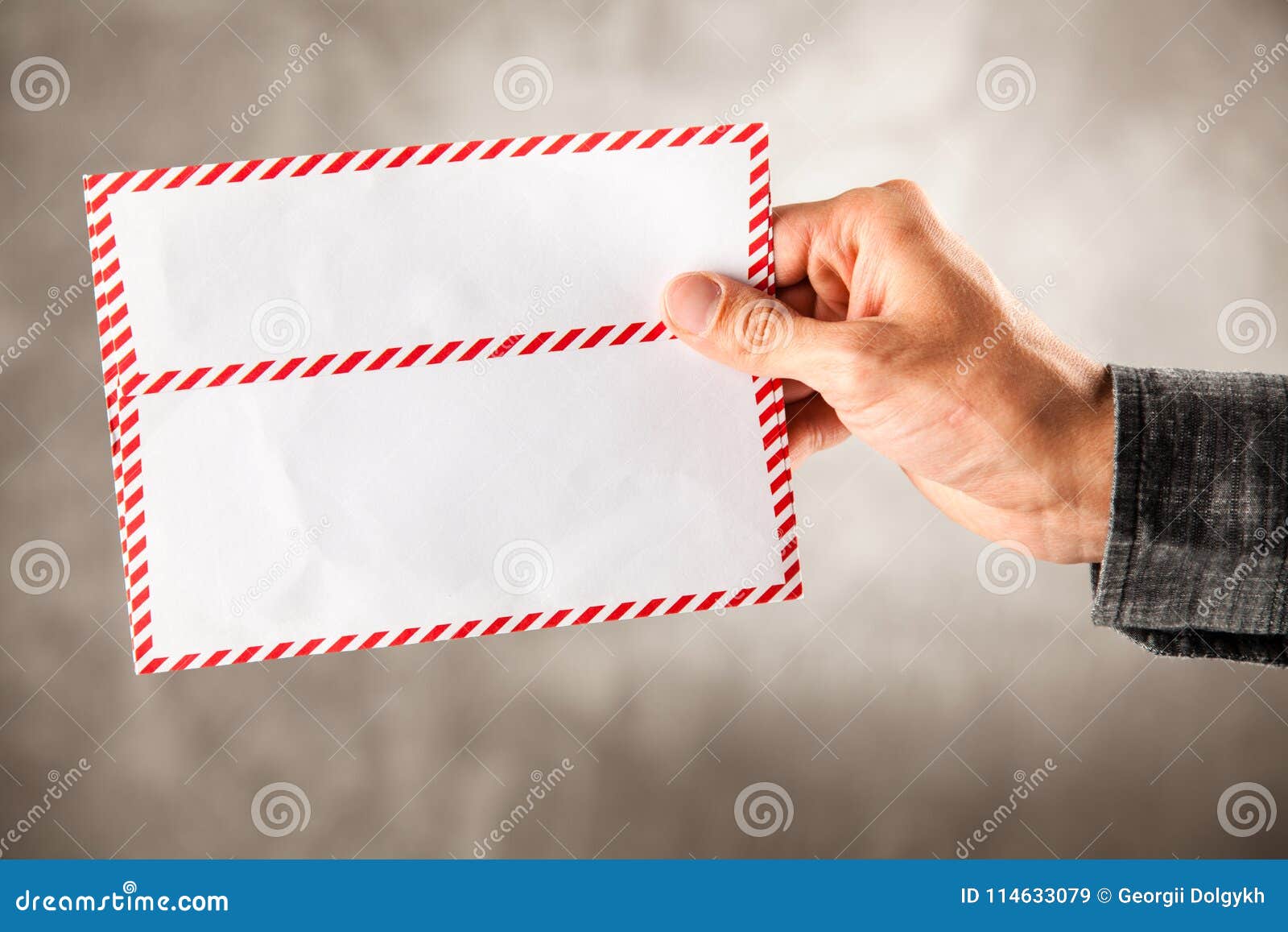 Male Hand Holding an Envelope Stock Image - Image of send, post: 114633079
