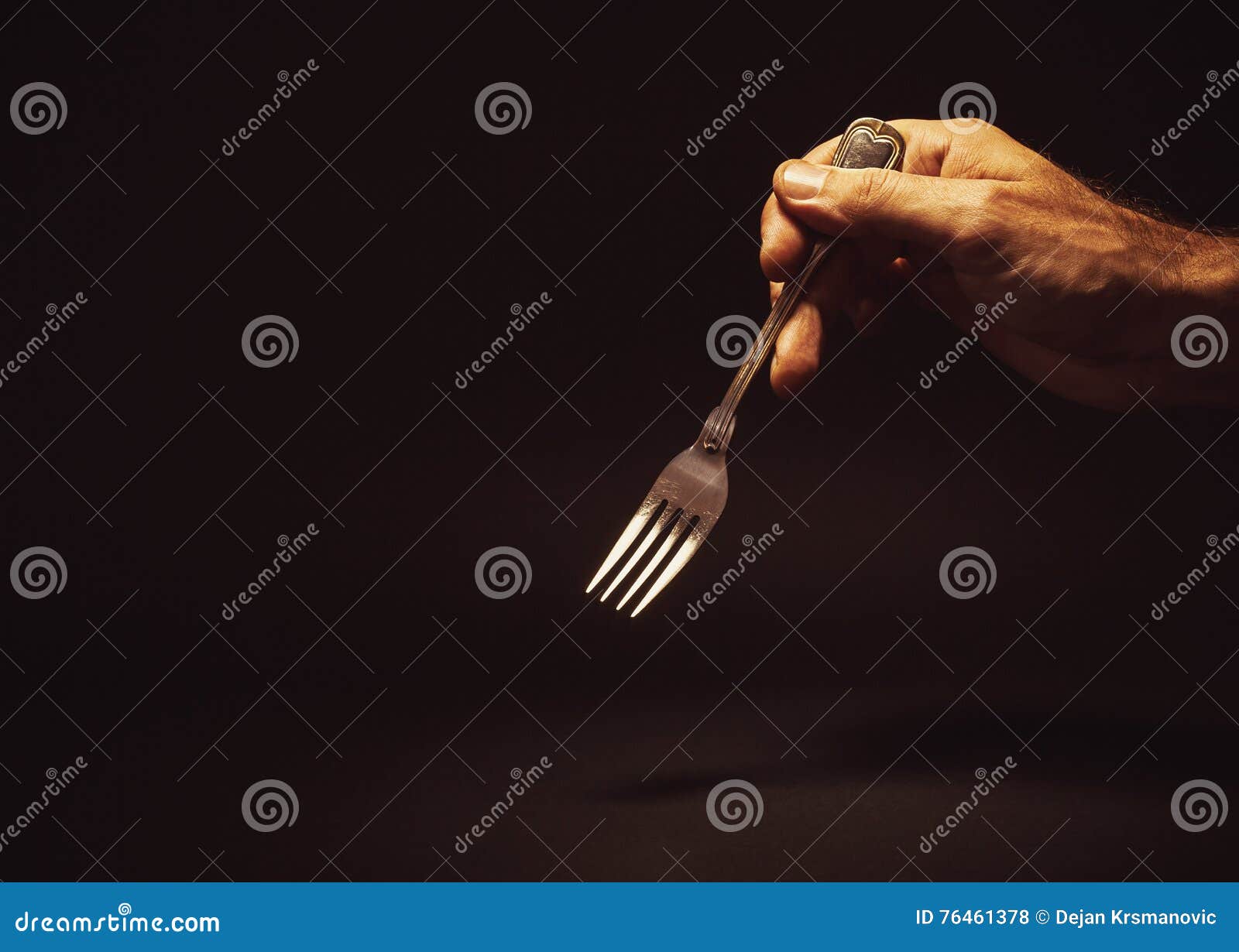 Male Hand Holding a Fork stock photo. Image of fork, reflections - 76461378