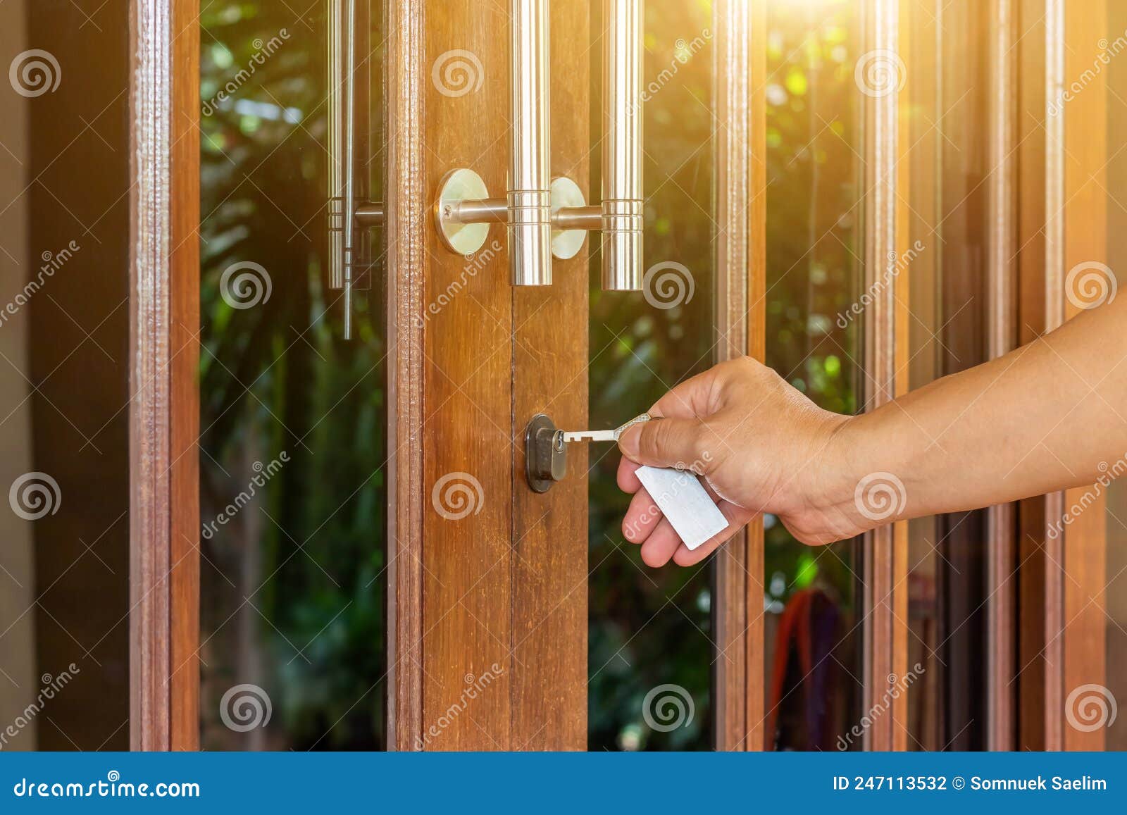 Male Hand Holding a Key in a Keyhole,Hand Holding the Key. Opening the ...