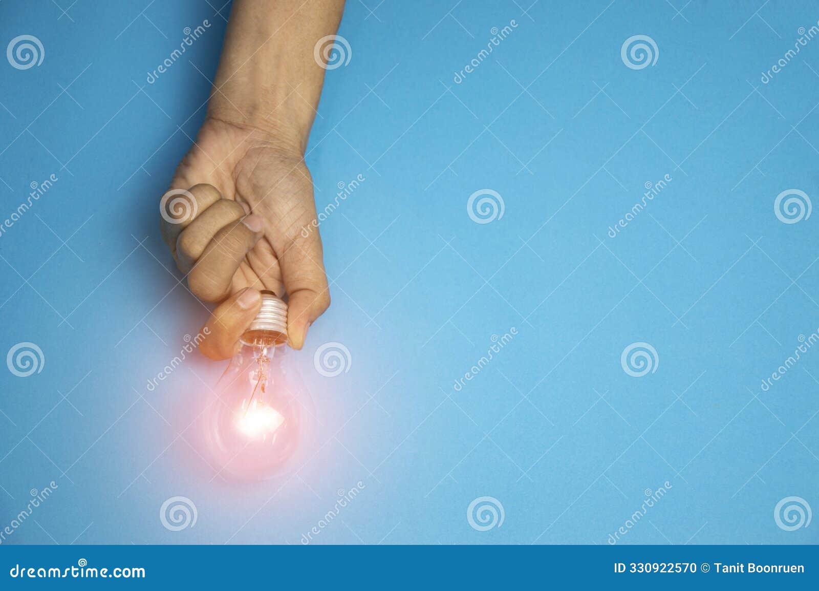 Male Hand Holding Light Bulb Down from Above Stock Photo - Image of ...