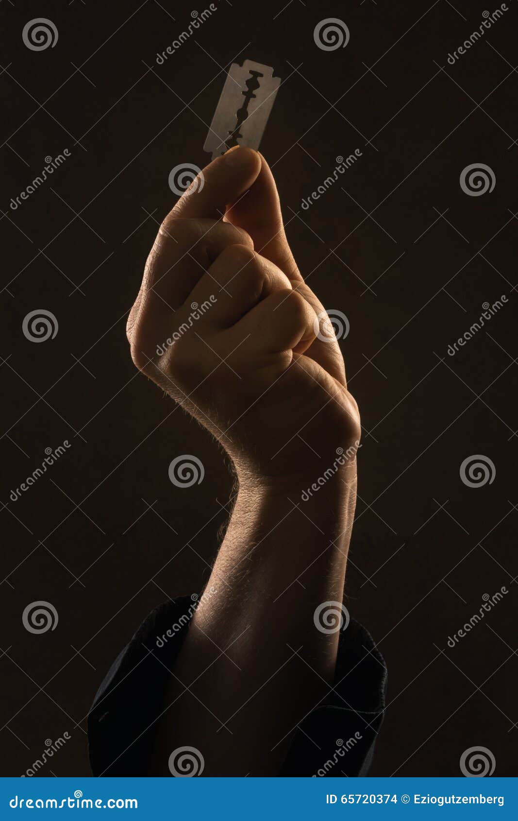 Male Hand Holding a Razor Blade Stock Photo - Image of silhouette ...
