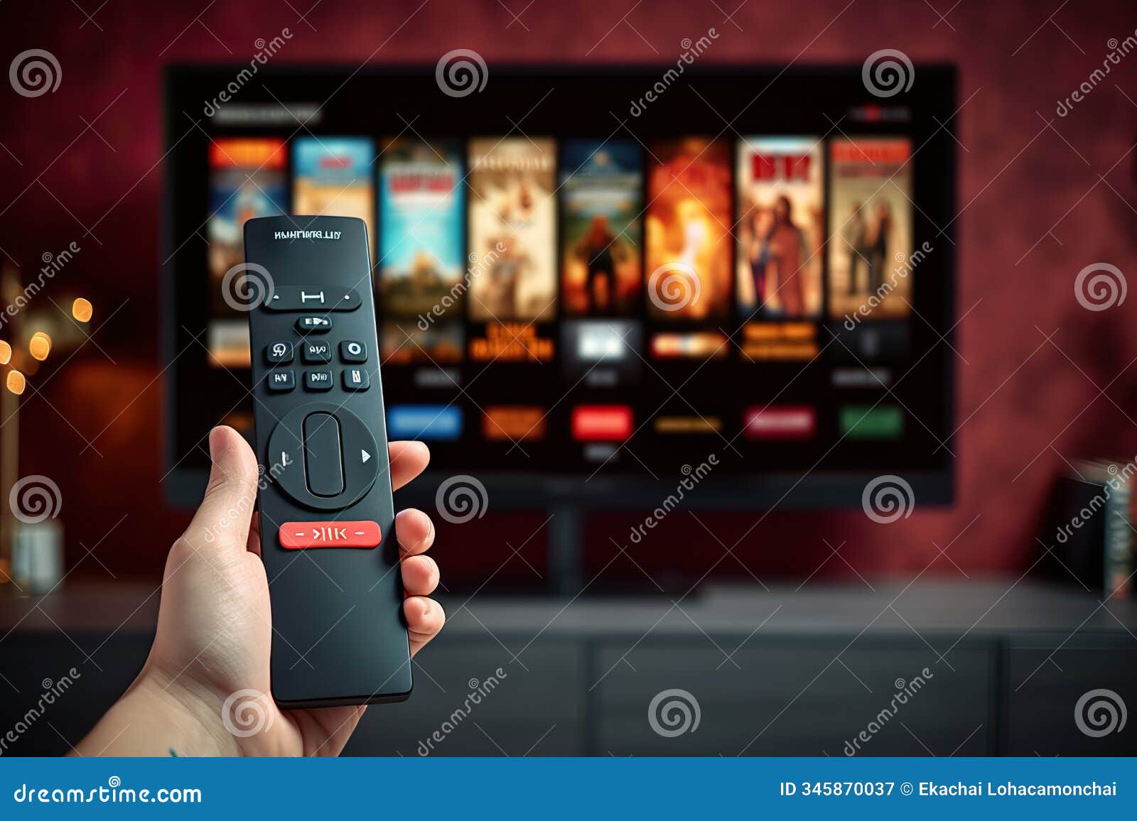 Male Hand Holding Remote Control for Online Television and Multimedia ...