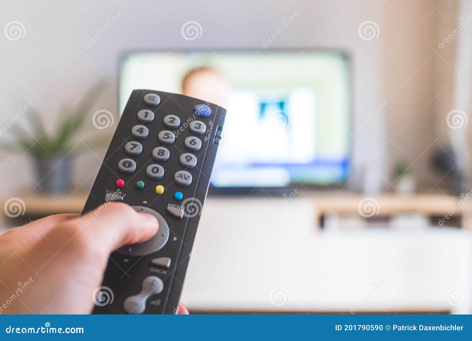 Male Hand is Holding TV Remote Control, Streaming on a Smart TV Stock ...