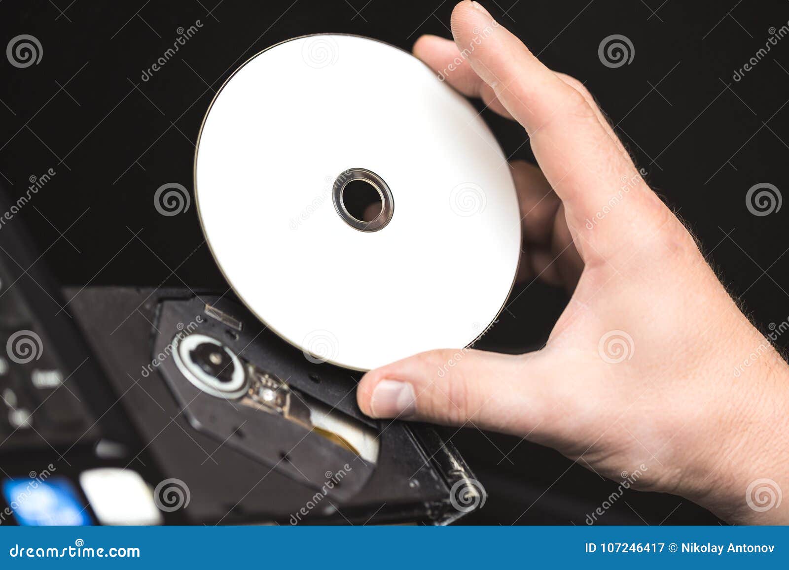 Male Hand Inserting a DVD into a Disk Drive. Stock Image - Image of ...
