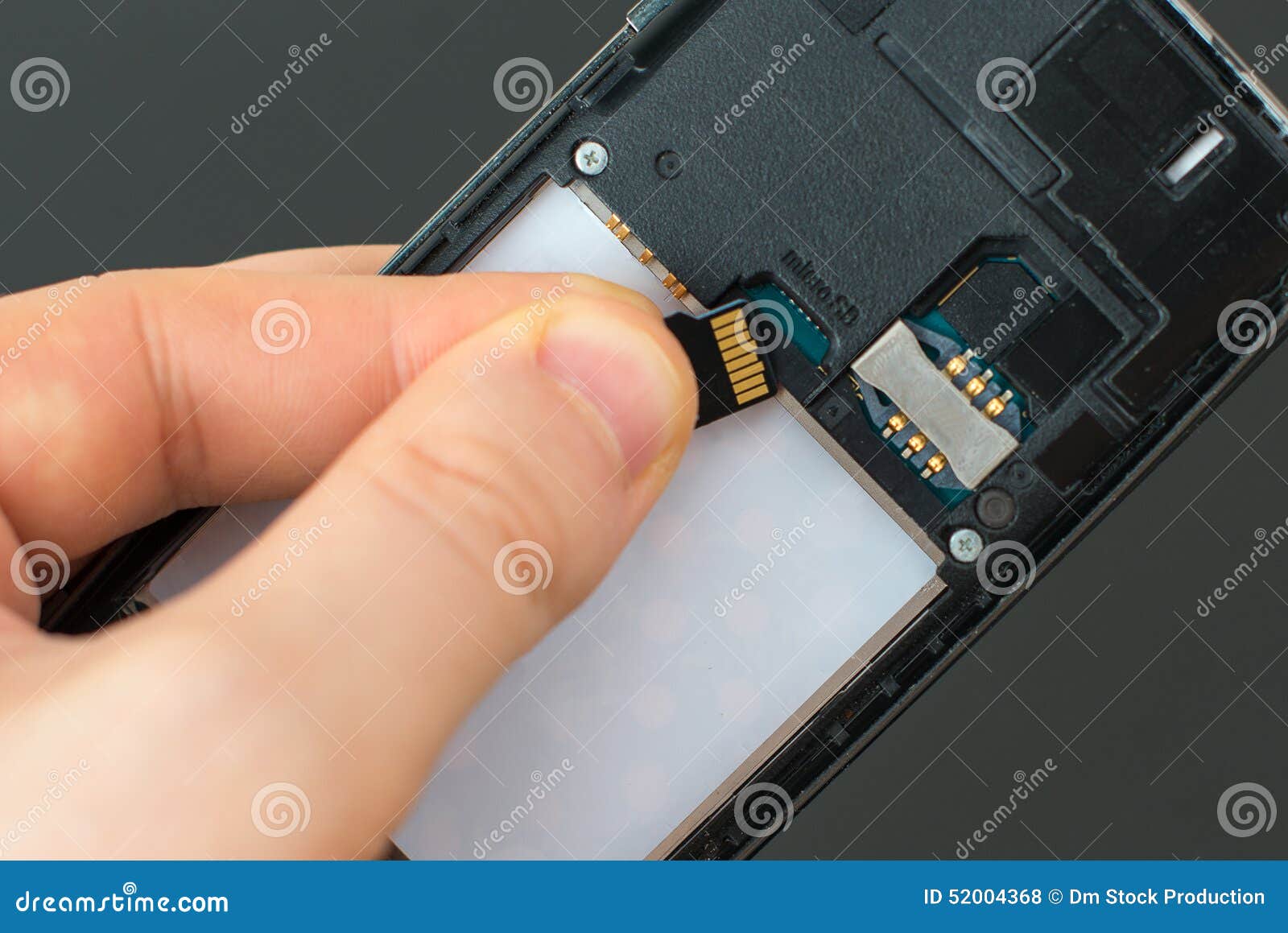 Male Hand Inserting Micro SD Card. Stock Photo - Image of cellular ...