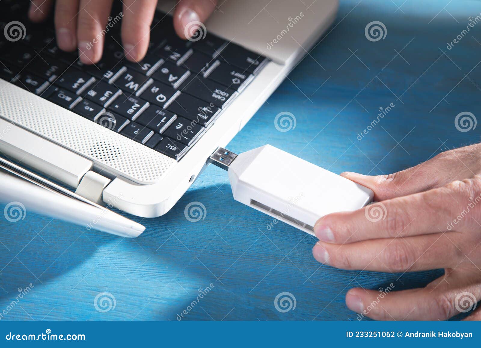 Male Hand Inserting USB Flash Drive into Laptop Computer Stock Photo ...