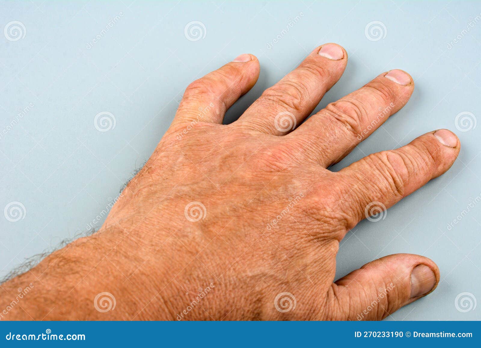 The Male Hand Lies on a Flat Plain Surface Stock Photo - Image of open ...