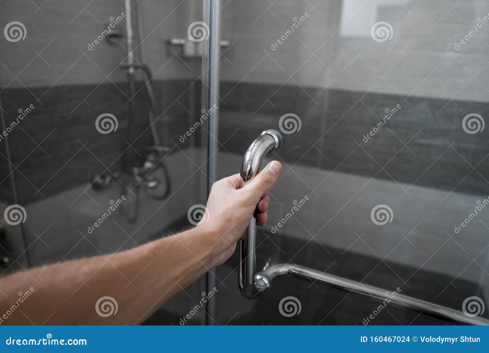 Male Hand Opens the Shower Door in a Modern Bathroom. Stock Photo ...