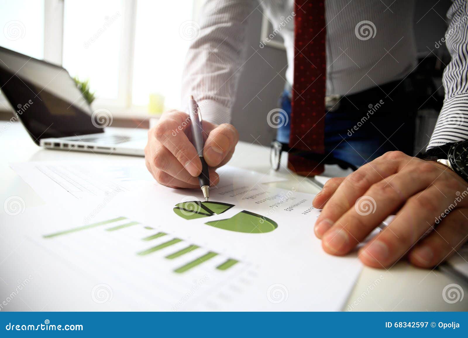 Male Hand Pointing at Business Document during Discussion at Meeting ...