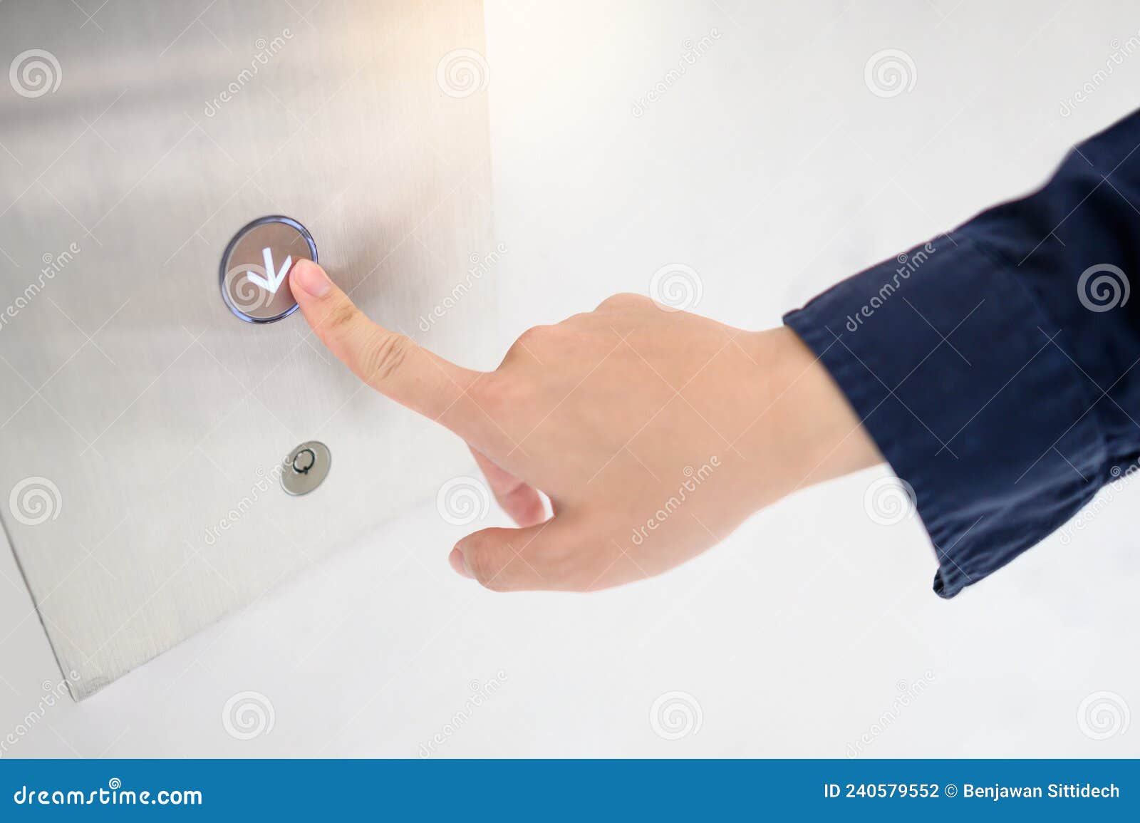 Male Hand Pressing on Down Symbol Button of Elevator Stock Photo ...