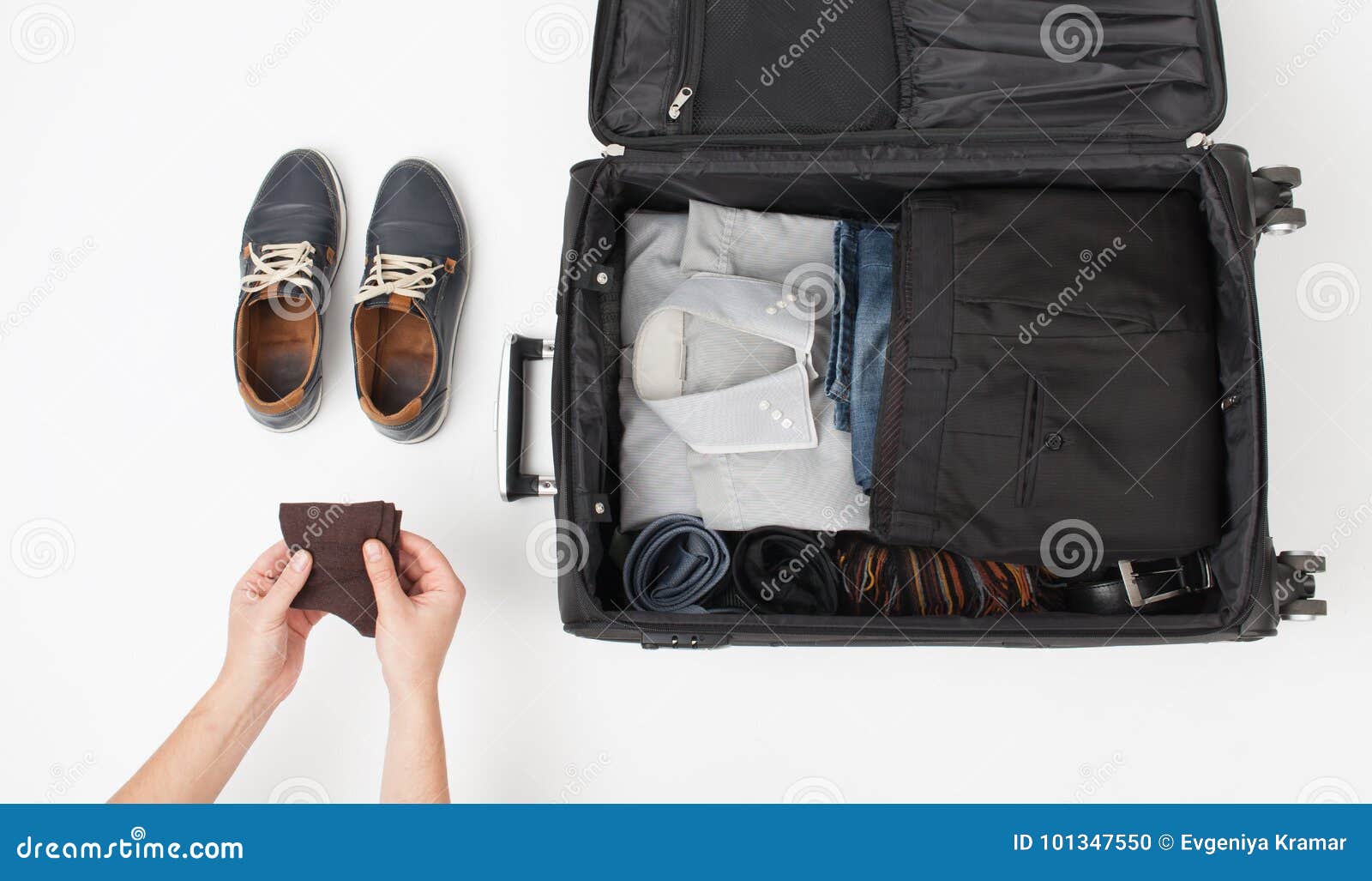 Male Hand Put Things in Suitcase on White Stock Photo - Image of camera ...