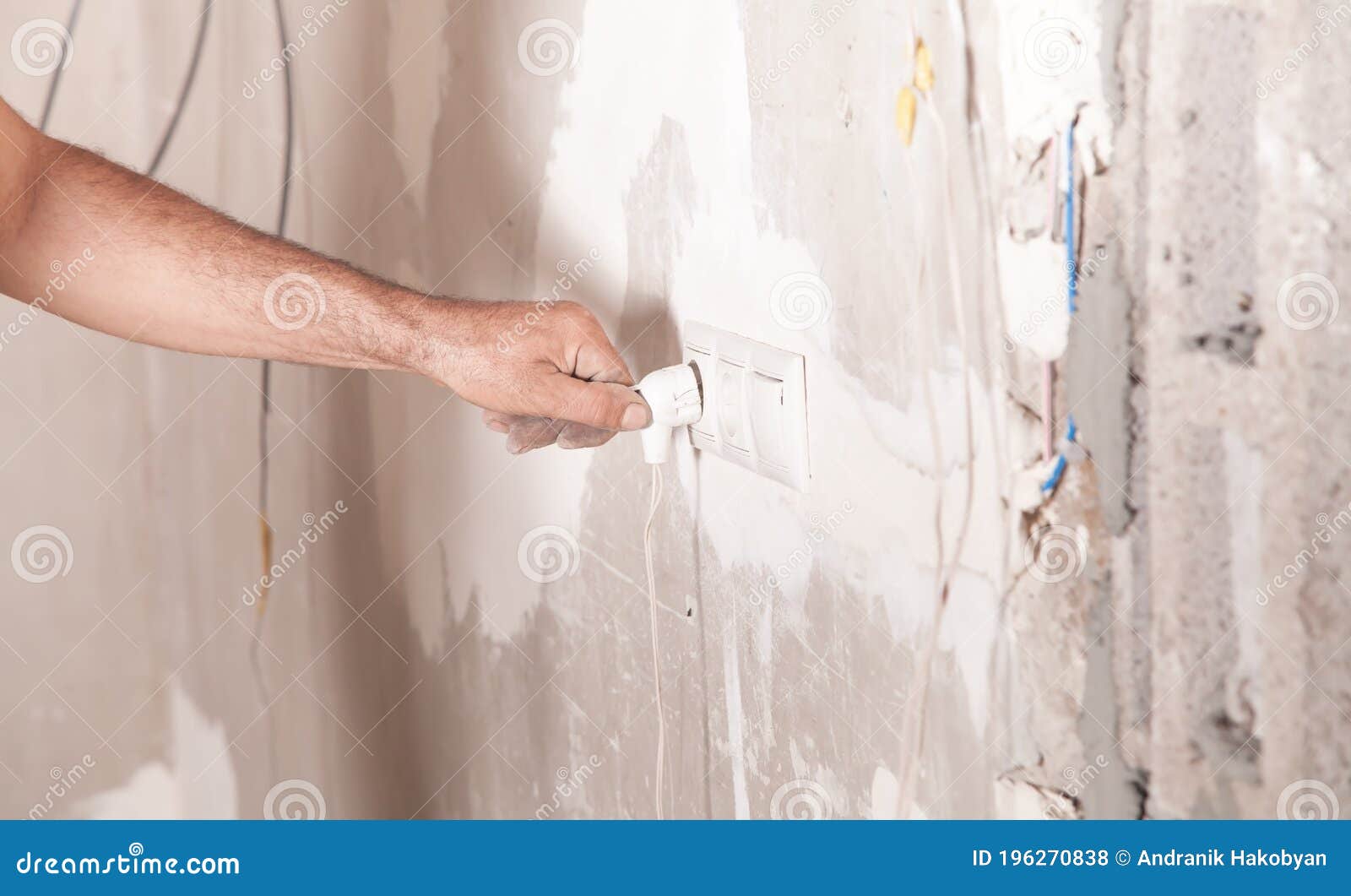 The Man Puts The Cable In The Server Room. The Technician Works In The ...