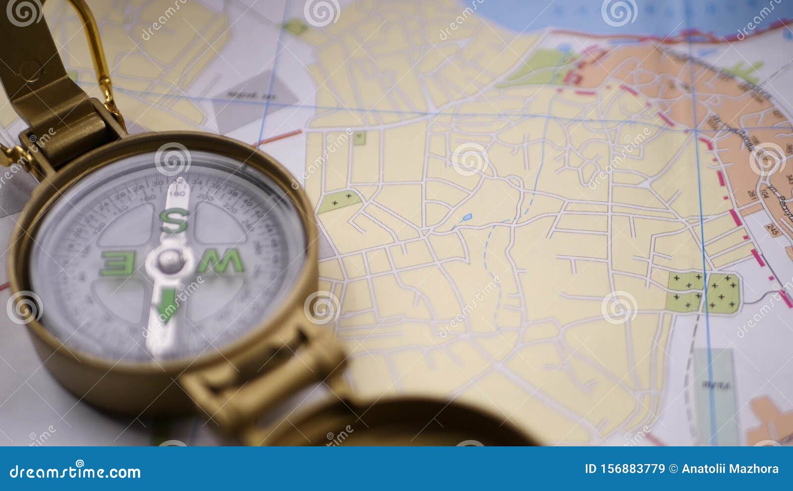 Male Hand Searching Direction on Map with Compass Background Stock ...