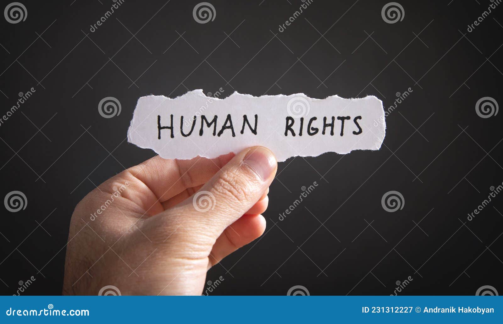 Male Hand Showing Human Rights Text on Torn Paper Stock Image - Image ...