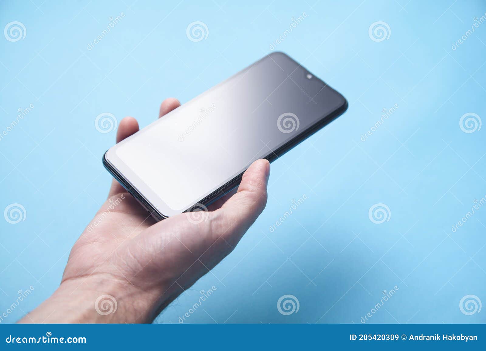 Male Hand Showing Smartphone on Blue Background Stock Image - Image of ...