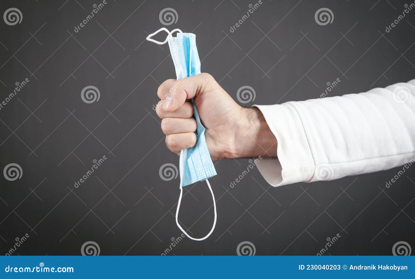 Male Hand Squeezing a Medical Mask Stock Image - Image of lockdown ...