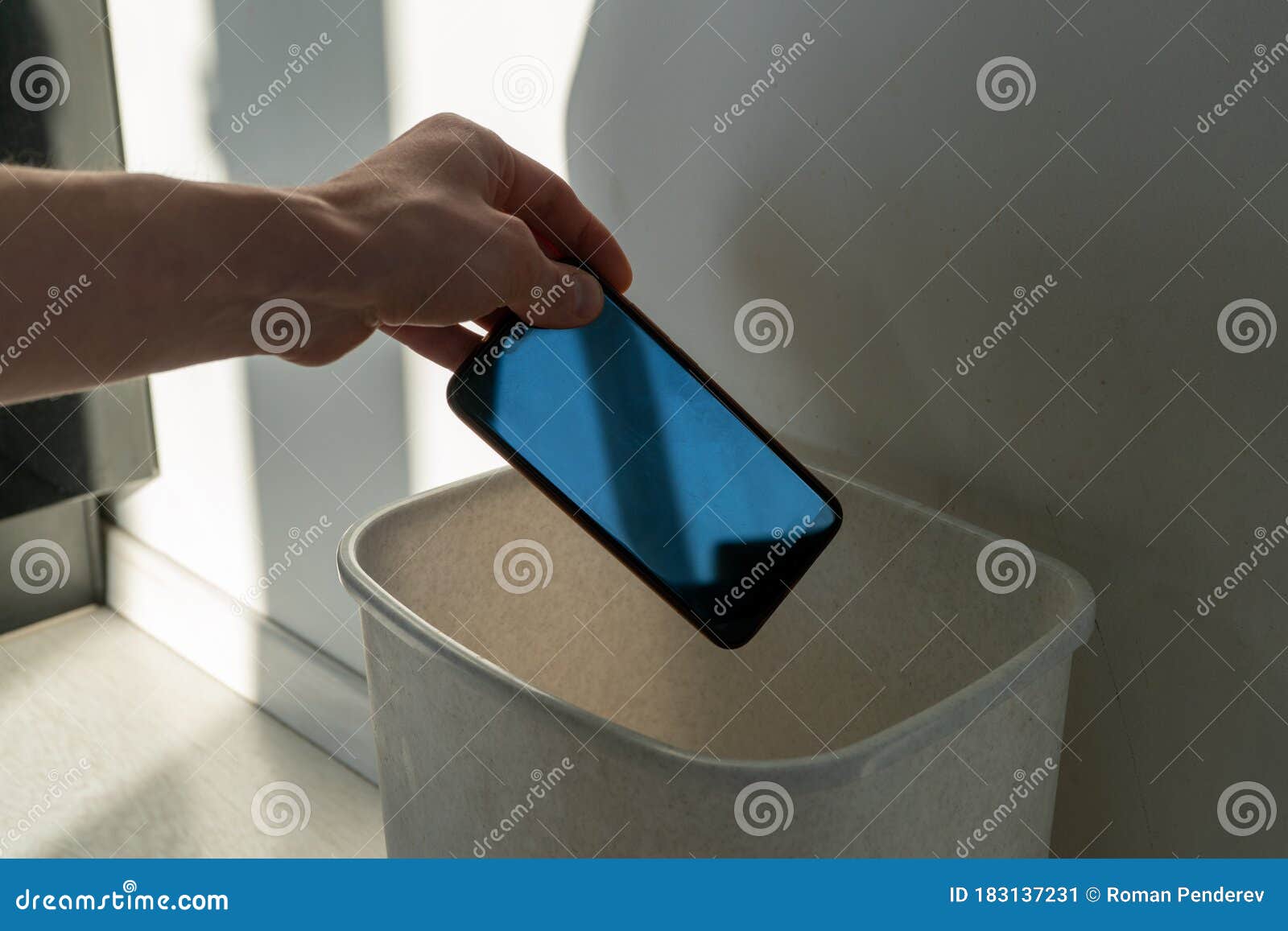 A Male Hand Throws a Smartphone into the Bin. Stock Image - Image of ...