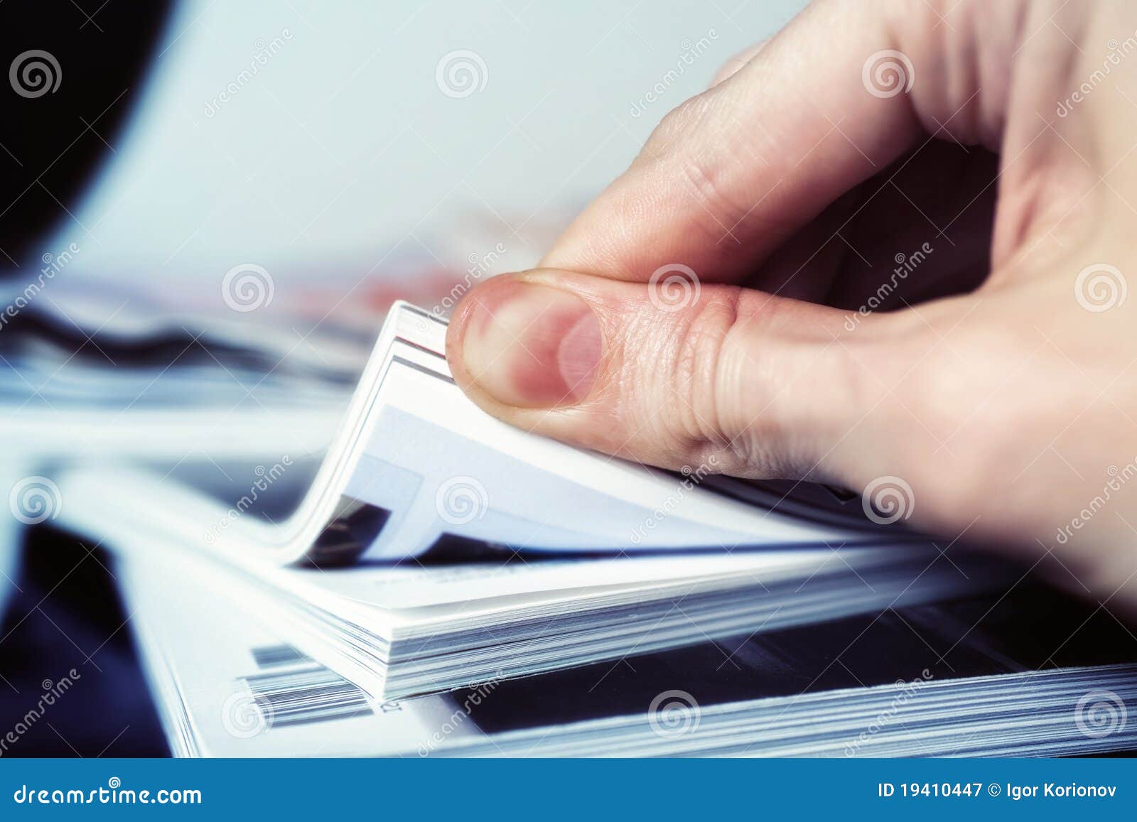 Male Hand Turned Over Stack of Magazines Stock Image - Image of ...