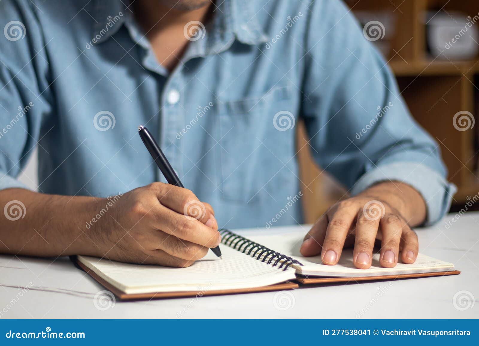 Male Hand Writing a Note in a Notebook Concept of Business People ...