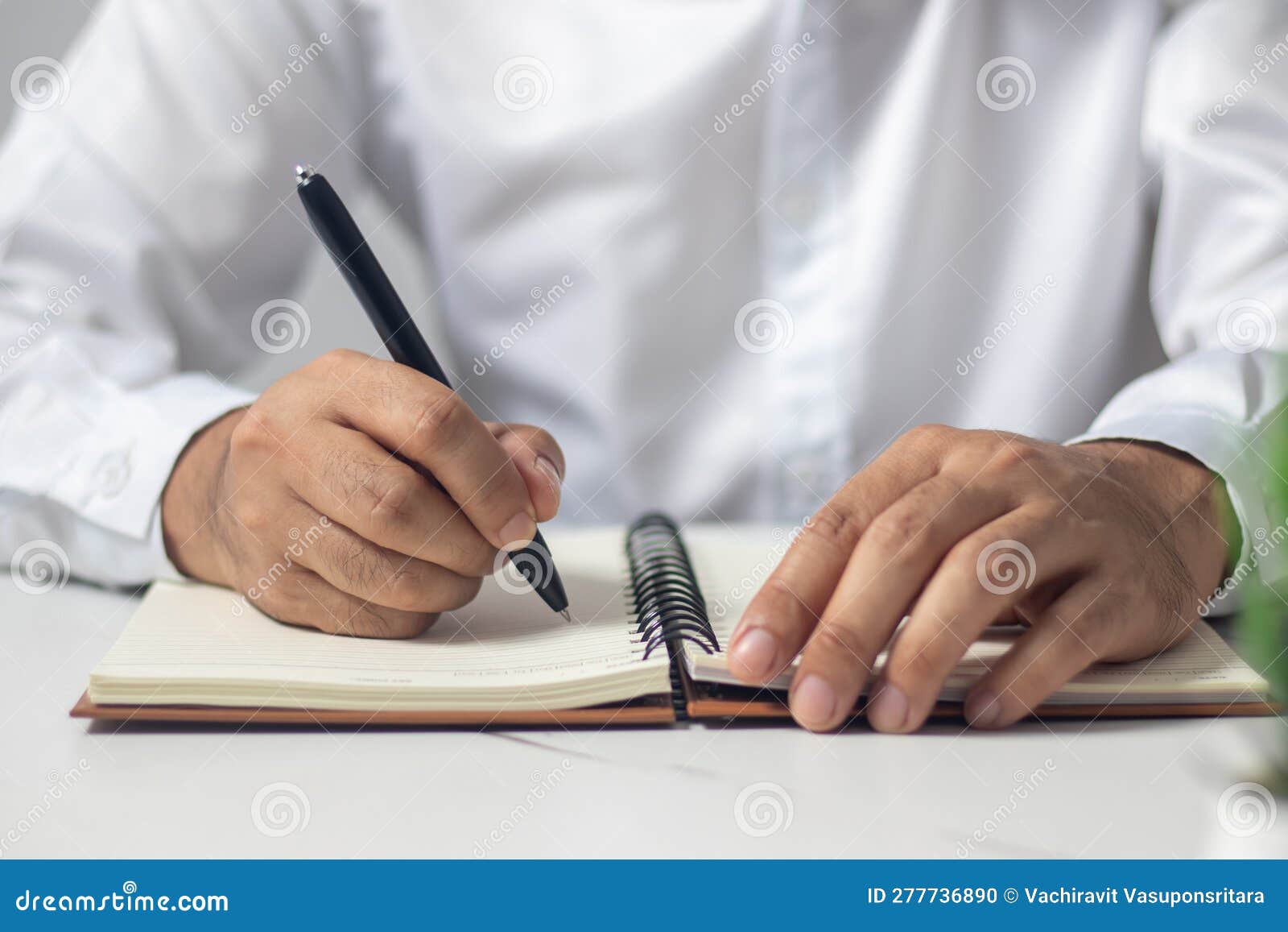 Male Hand Writing a Note in a Notebook Concept of Business People ...