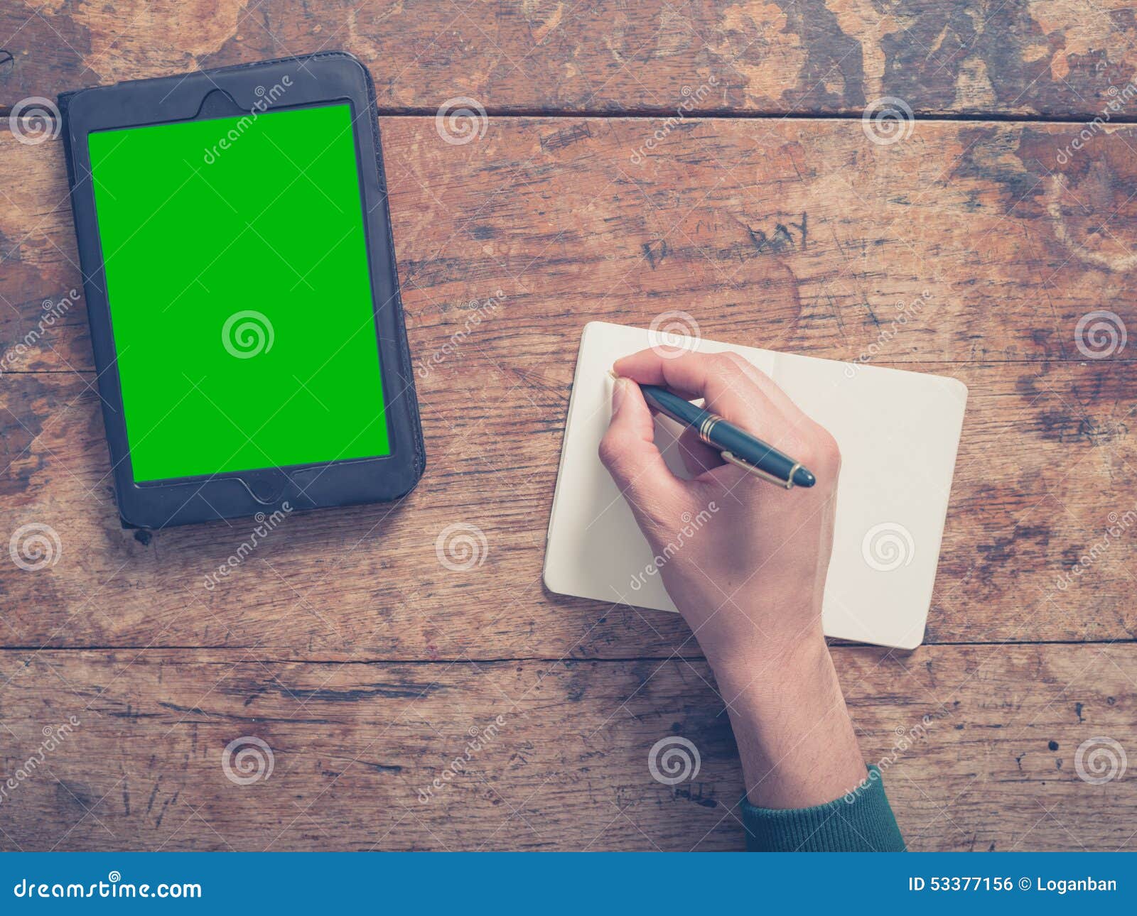 Male Hand Writing in Notepad and Using Tablet Stock Photo - Image of ...