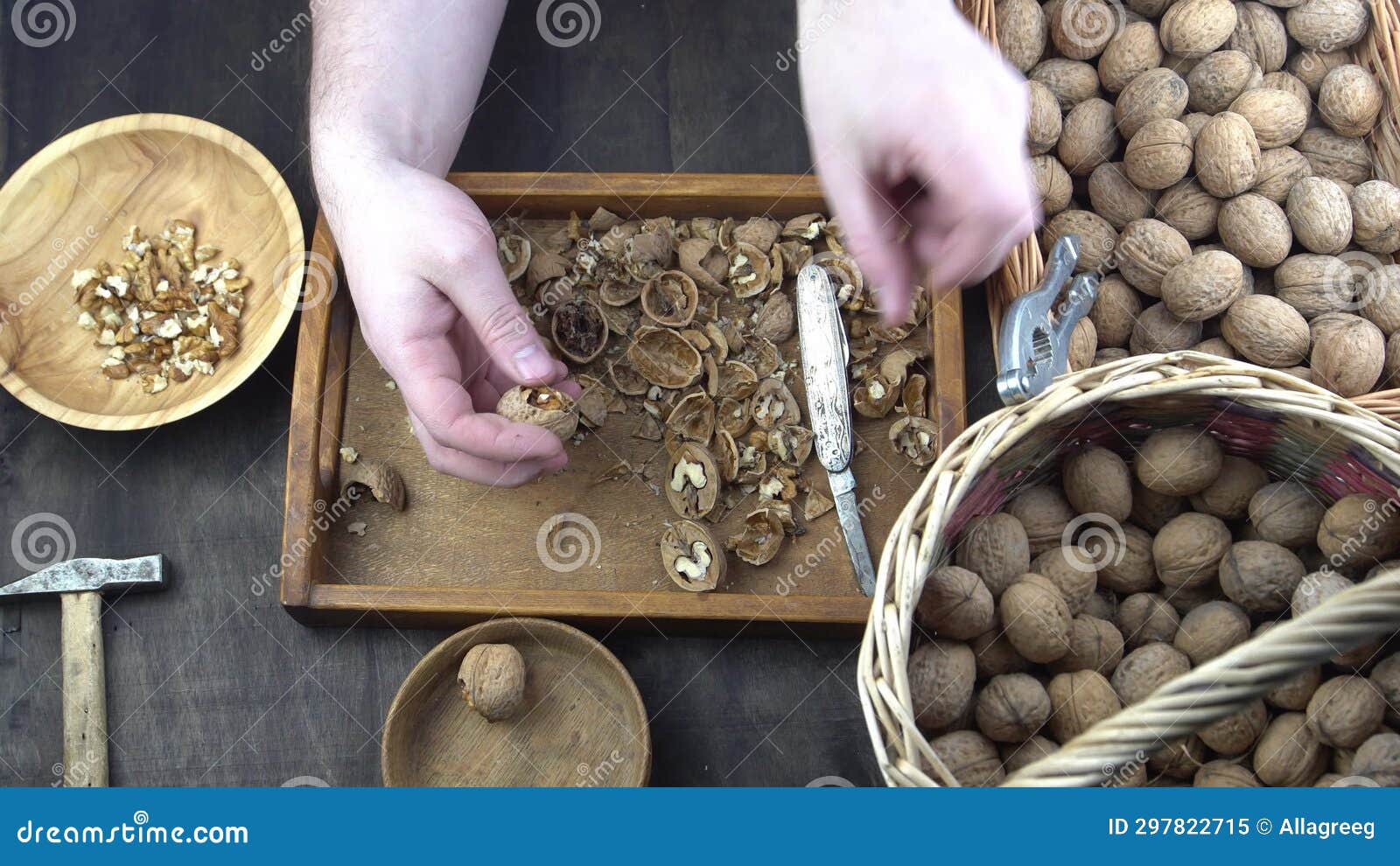 Male Hands Clean Nuts with a Nut Cracker. Close-up. Walnut in Shell Top ...