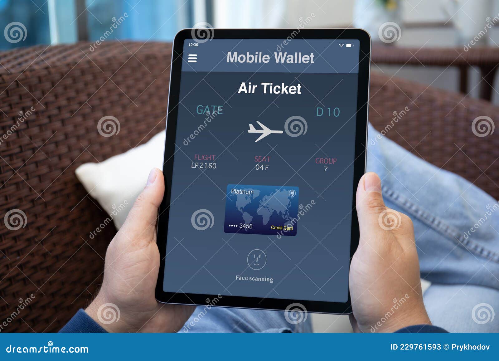 Male Hands Holding Computer Tablet with Airplane Ticket Application ...