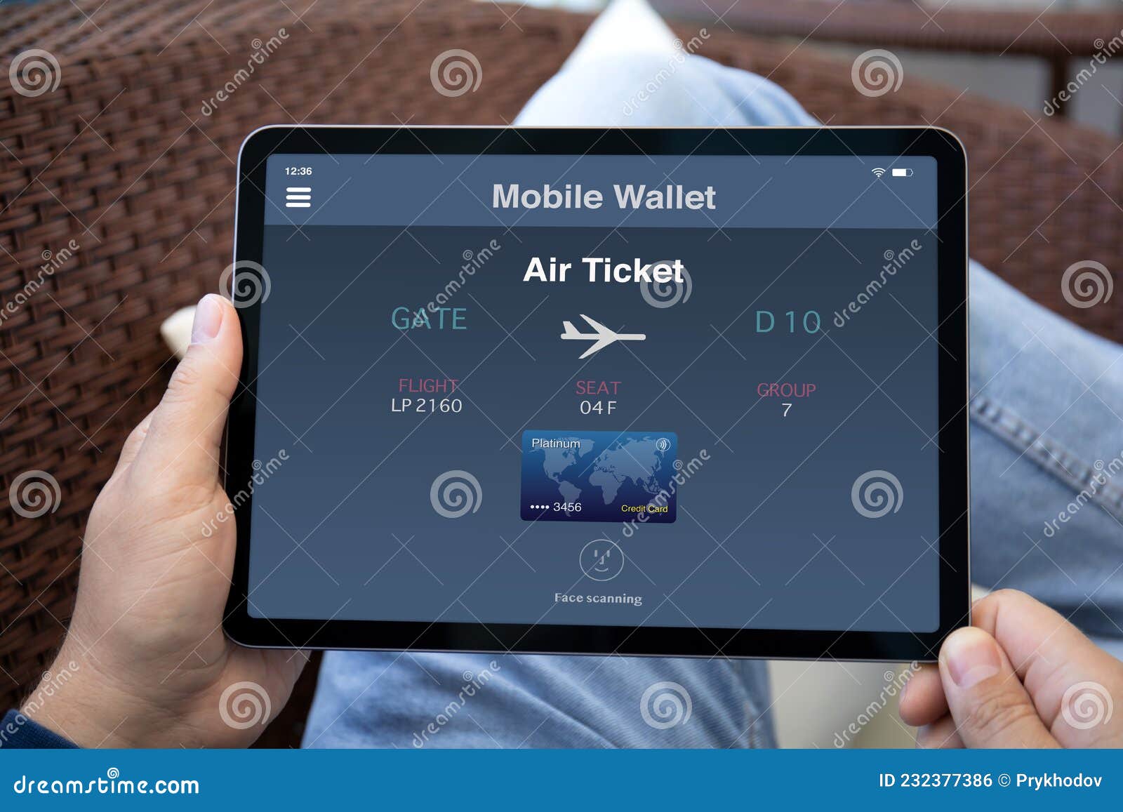 Male Hands Holding Computer Tablet with Airplane Ticket Application ...