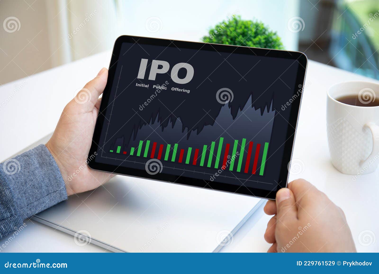 Male Hands Holding Computer Tablet with IPO Stocks Purchase App Stock ...
