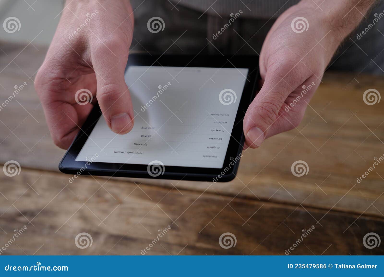 Male Hands Holding Modern Black E-book Reader, Digital Book, Tablet ...