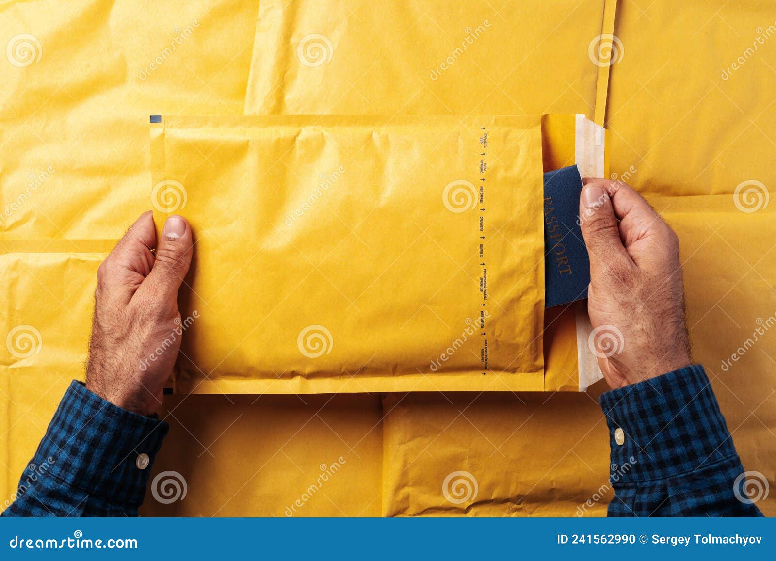 Male Hands Packing Bubble Envelopes for Shipping. Stock Photo - Image ...