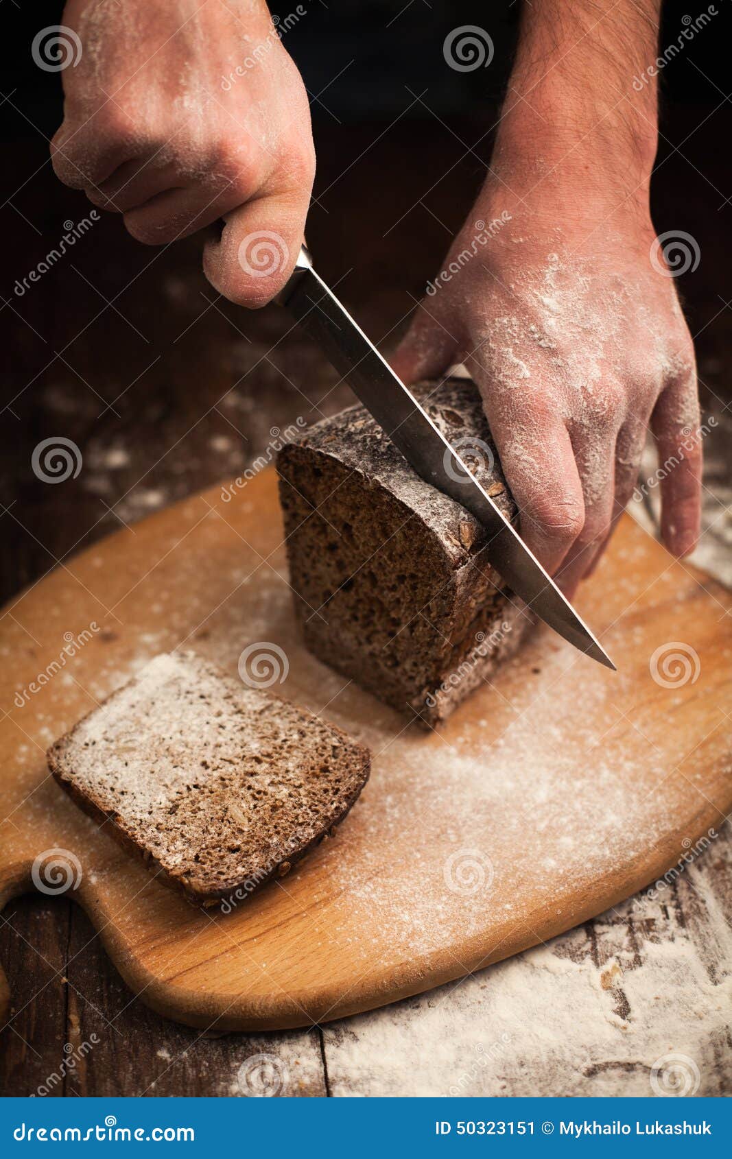 Male Hands Slicing Fresh Bread on Table Stock Image - Image of ...