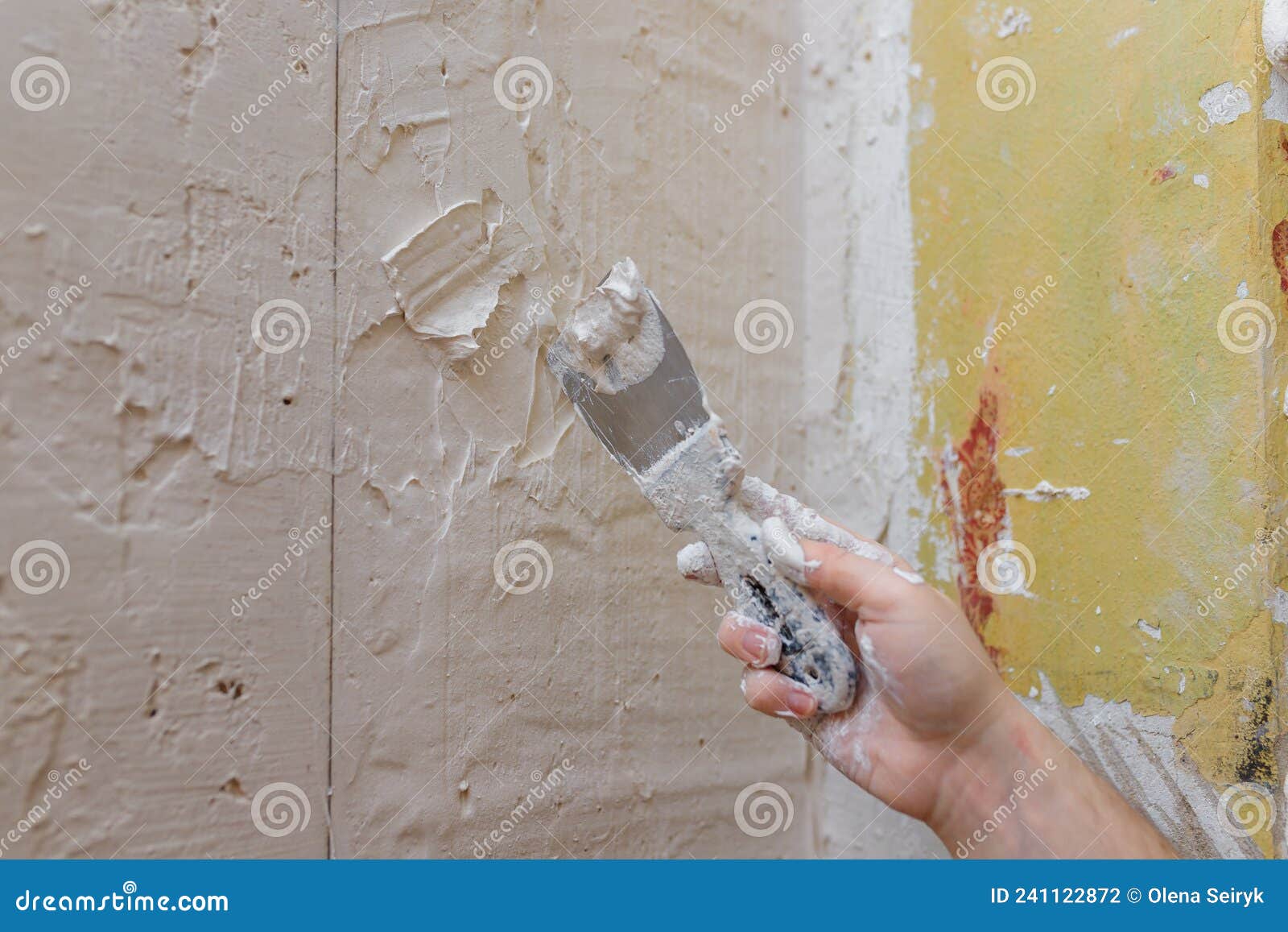 Male Hands with Spatula Using Putty for Wall, Builder Making Overhaul ...