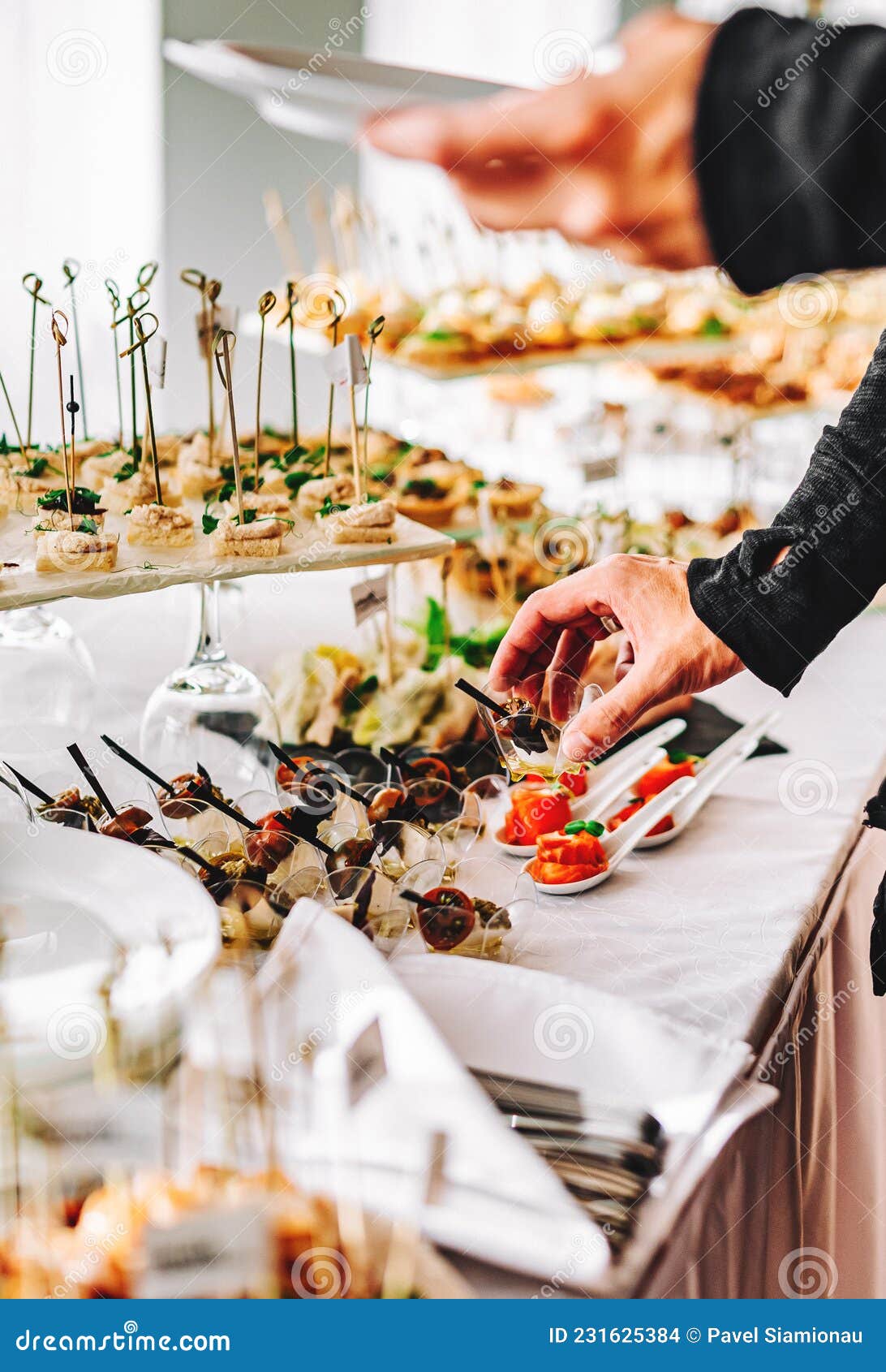Male Hands Take a Snack and Put it on Plate. Buffet Stock Photo - Image ...