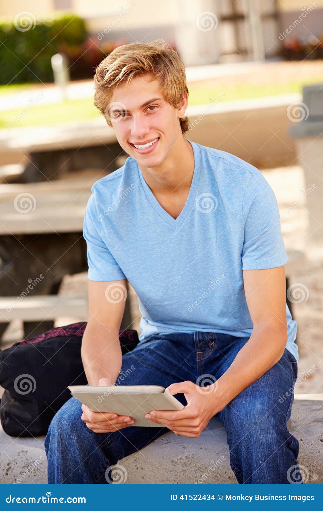 Male High School Student Using Digital Tablet Outdoors Stock Photo ...