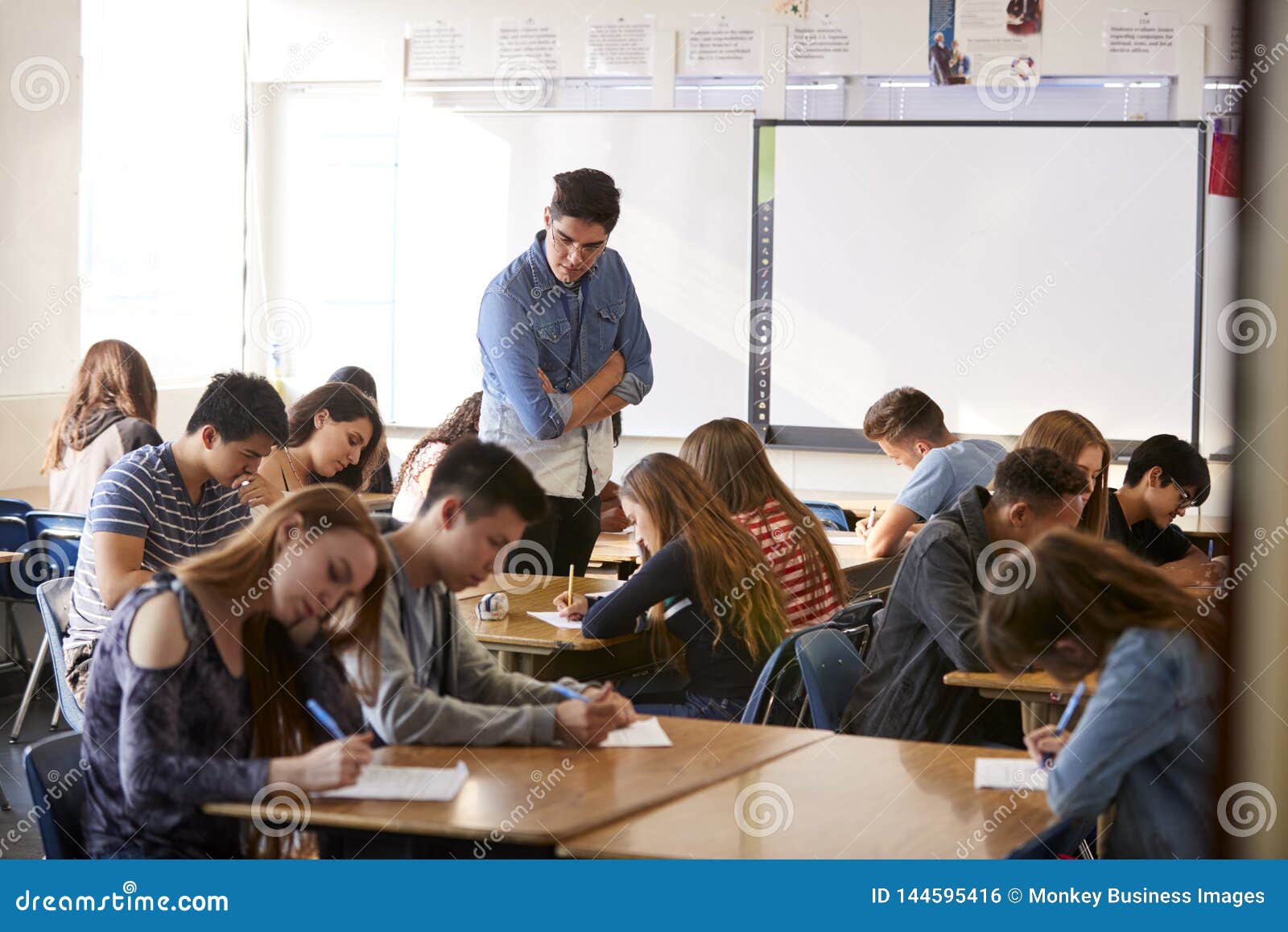 Male High School Teacher Standing by Interactive Whiteboard Teaching ...