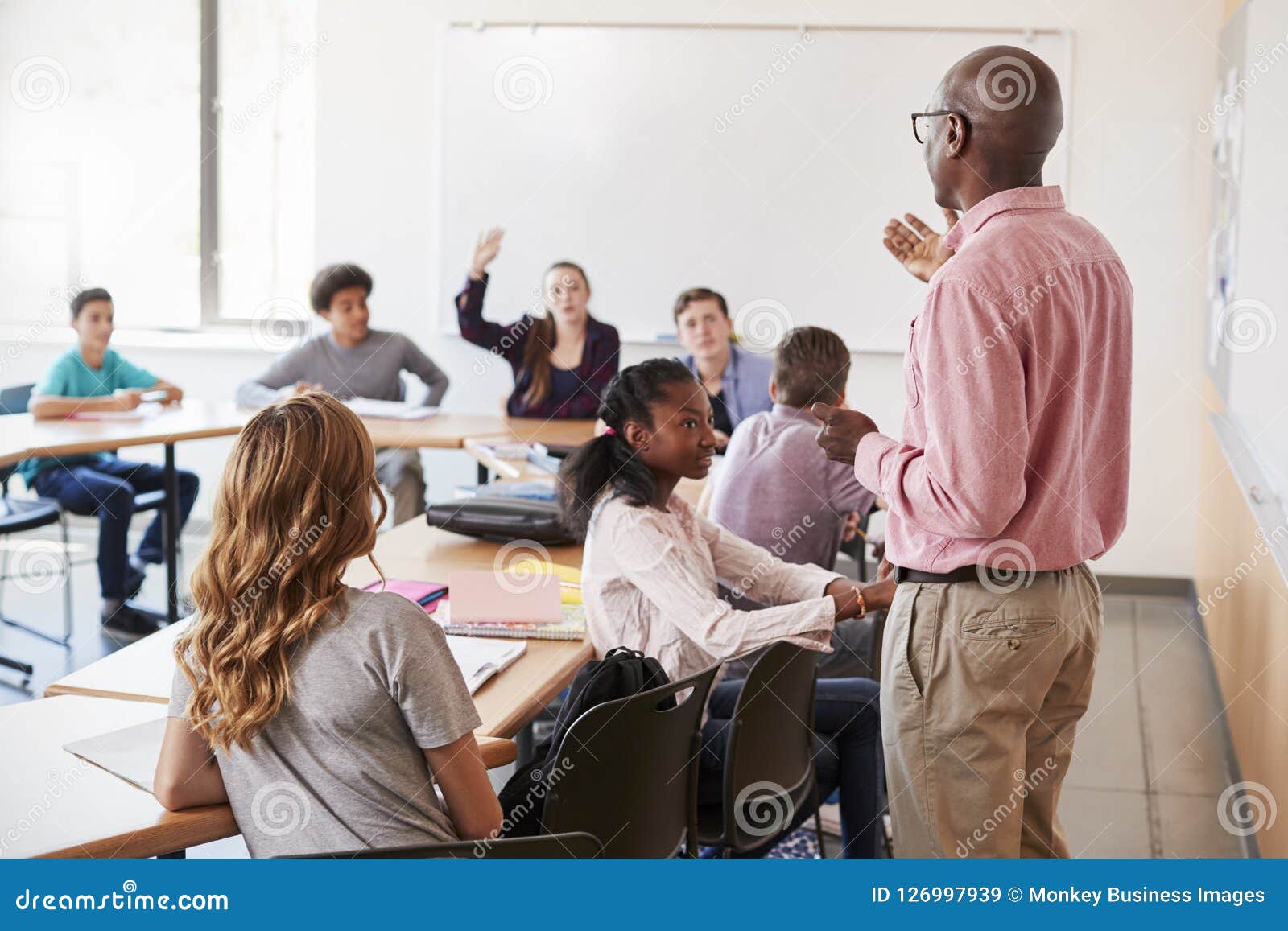 Male High School Tutor Standing at Whiteboard Teaching Class Stock ...