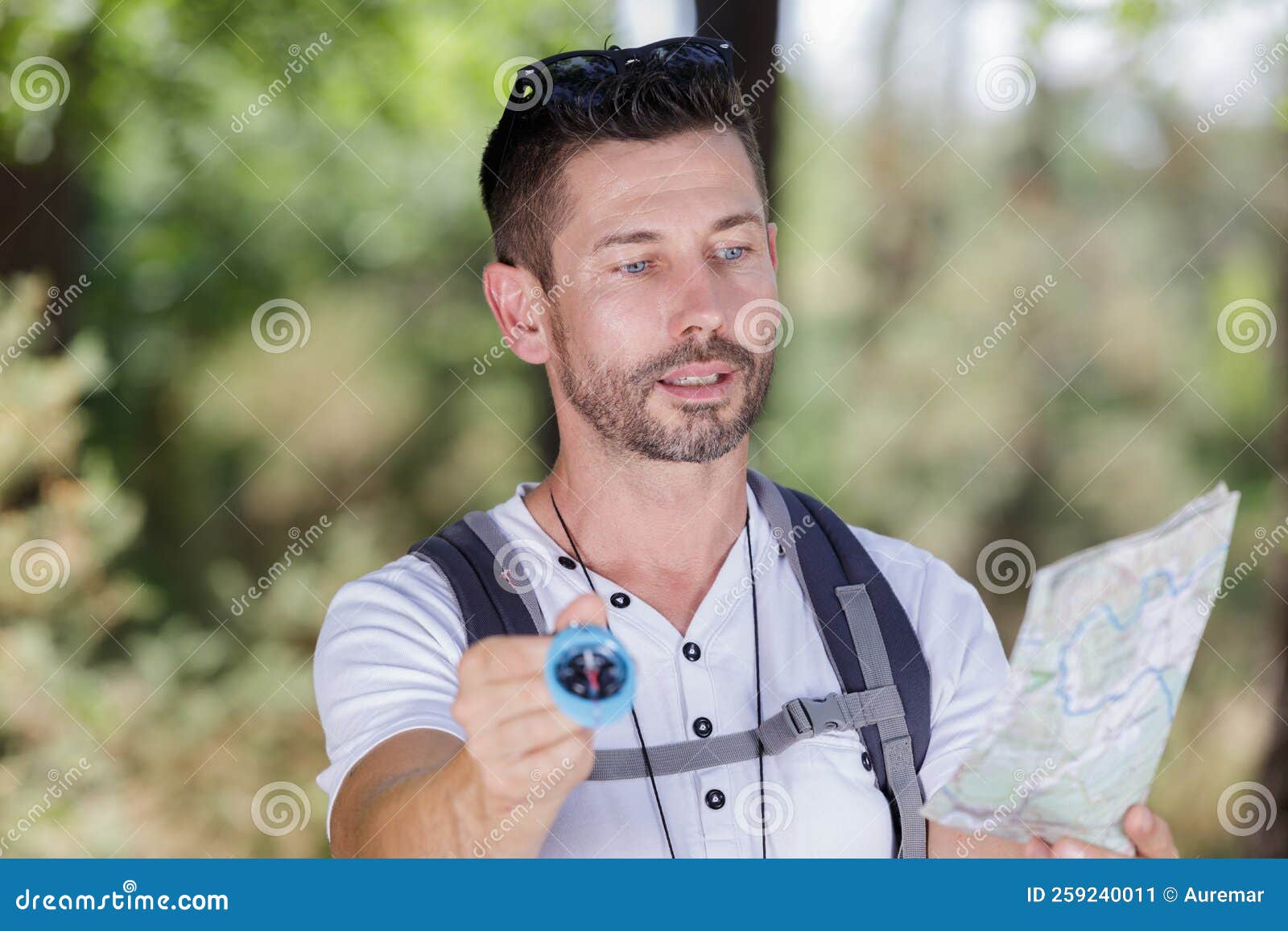 Male Hiker Reading Map and Holding Compass Stock Image - Image of hand ...