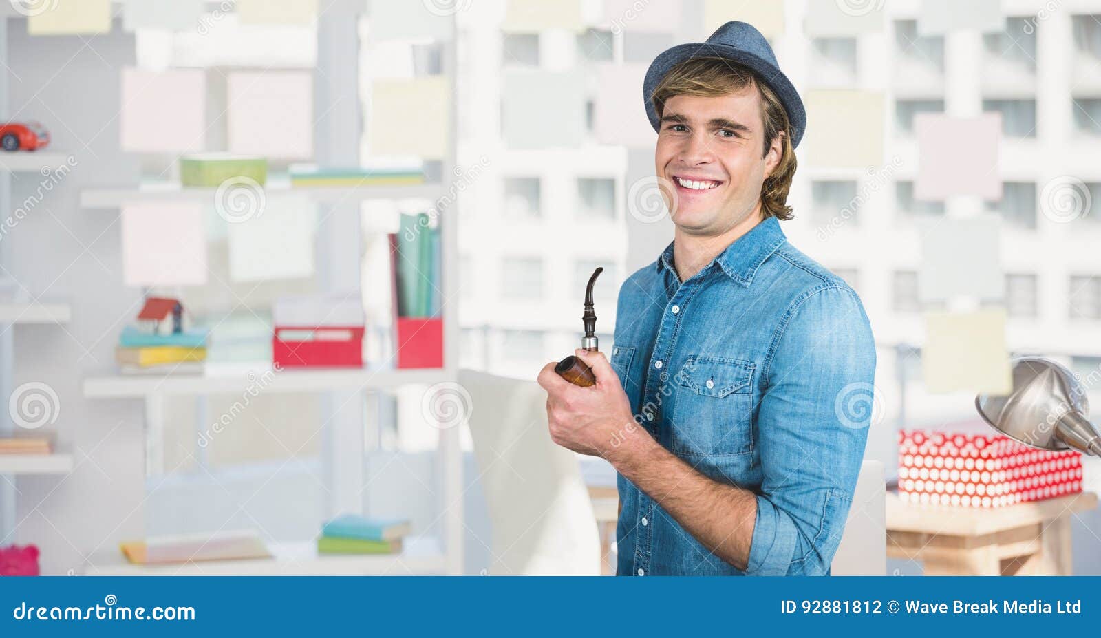 Male Hipster Smiling while Holding Smoking Pipe Stock Photo - Image of ...