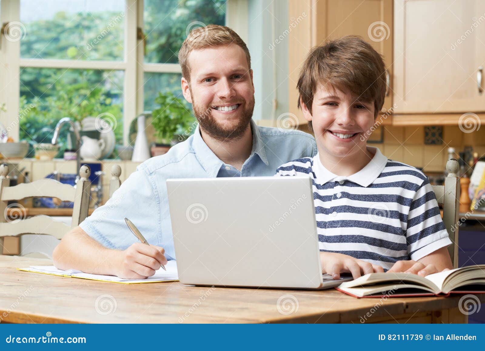 Male Home Tutor Helping Boy with Studies Stock Image - Image of person ...