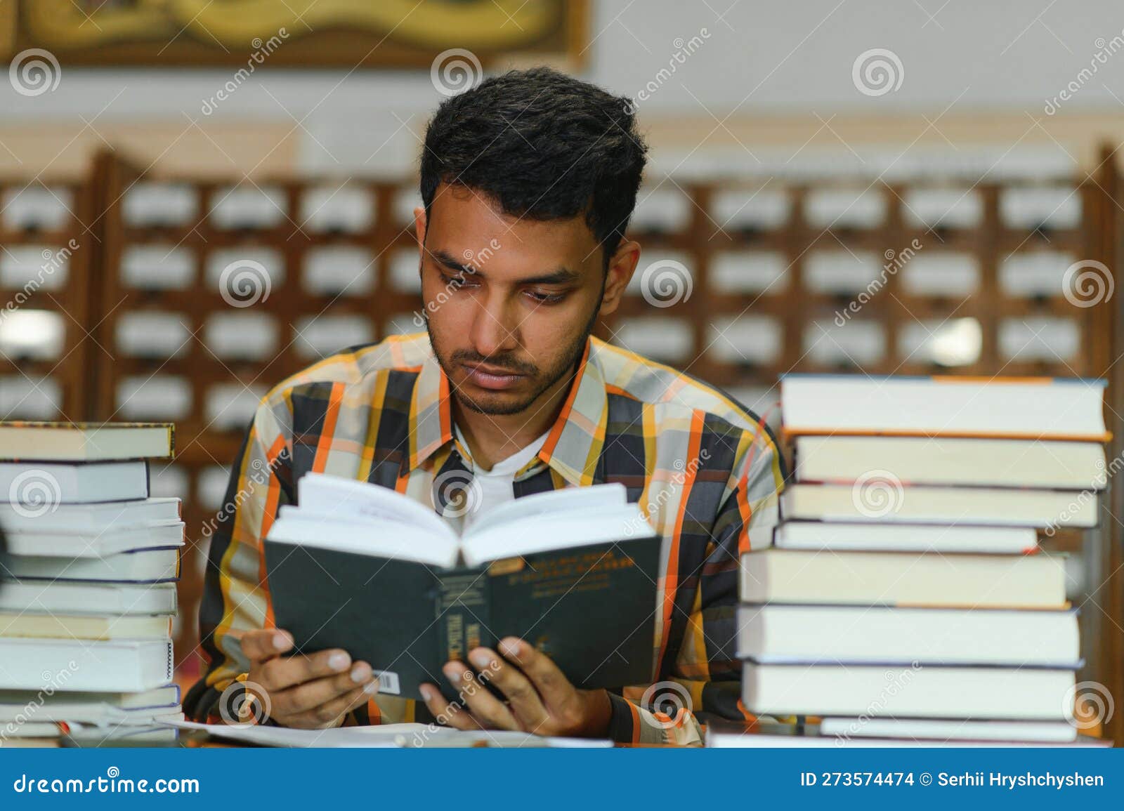 Male Indian Student at the Library with Book Stock Photo - Image of ...