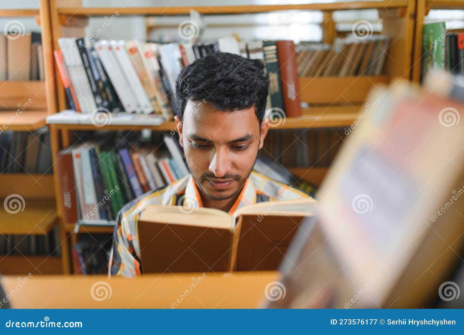 Male Indian Student at the Library with Book Stock Image - Image of ...