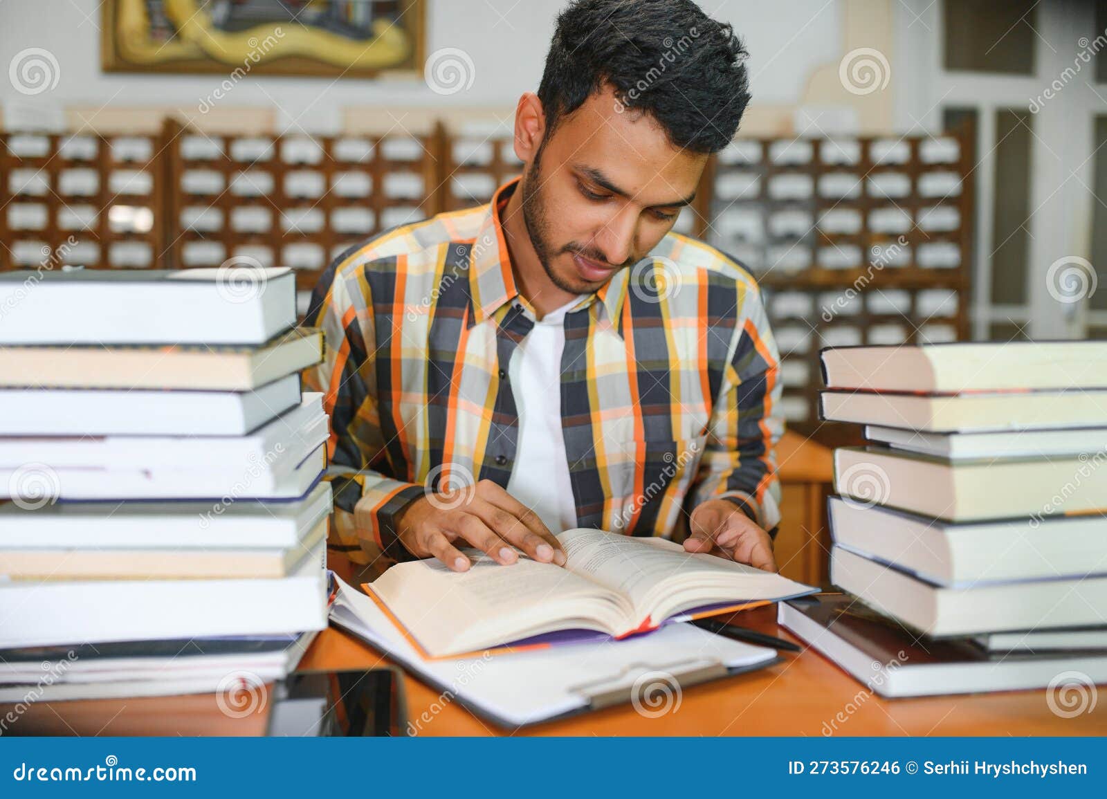 Male Indian Student at the Library with Book Stock Photo - Image of ...