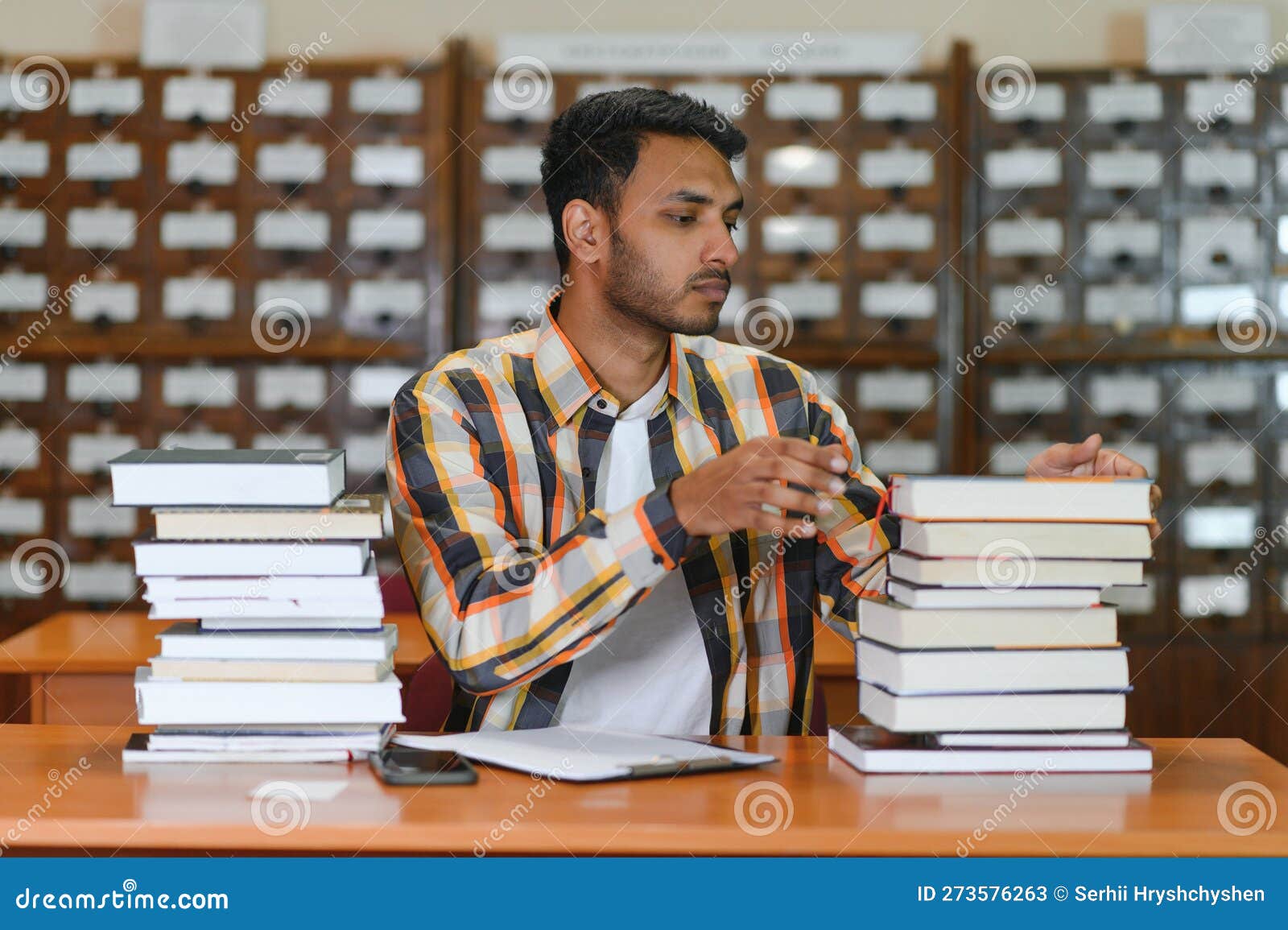 Male Indian Student at the Library with Book Stock Image - Image of ...