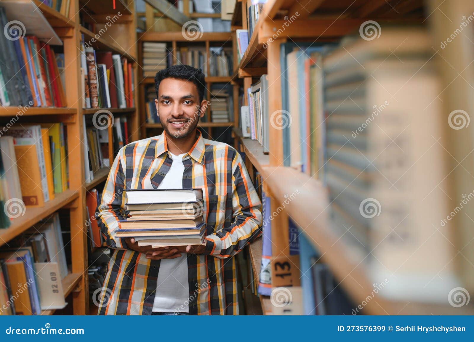 Male Indian Student at the Library with Book Stock Image - Image of ...