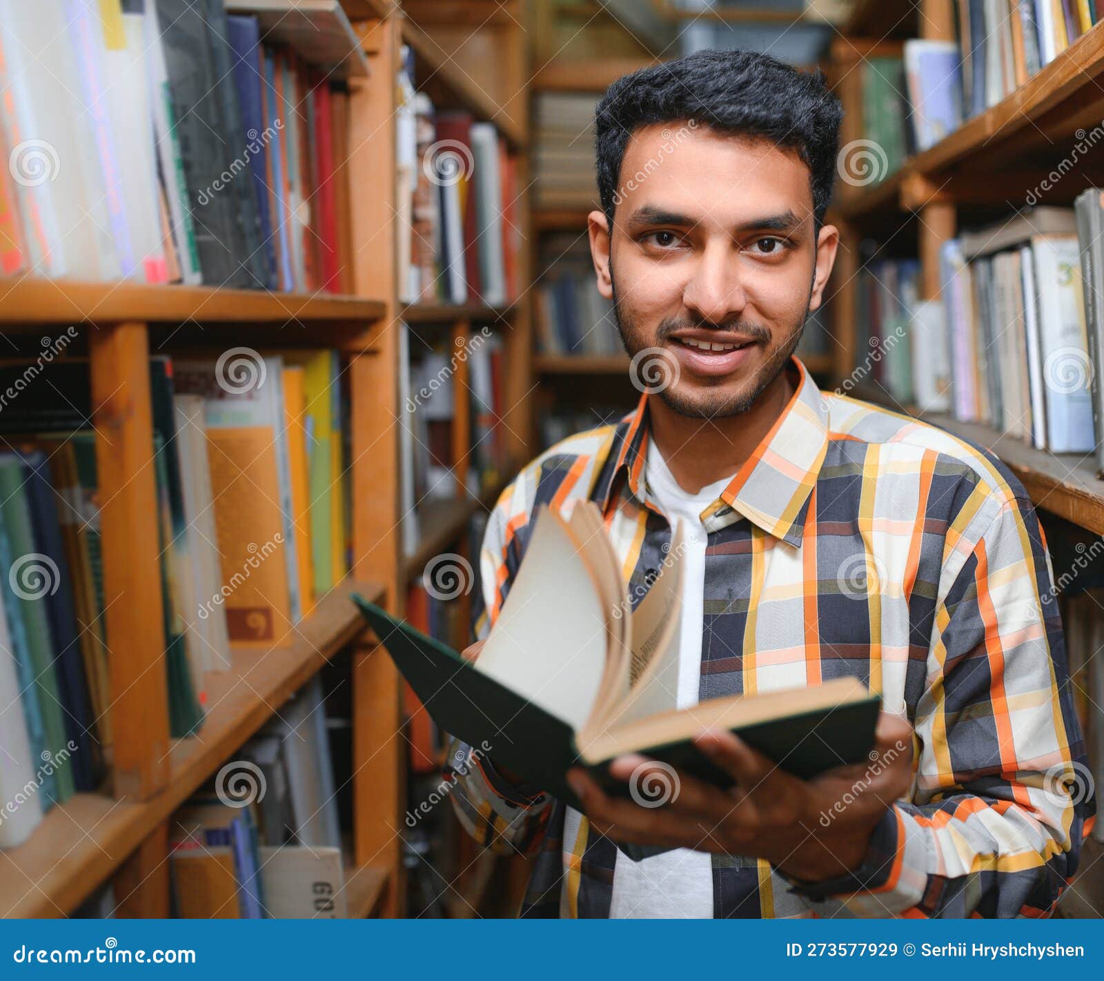 Male Indian Student at the Library with Book Stock Image - Image of ...