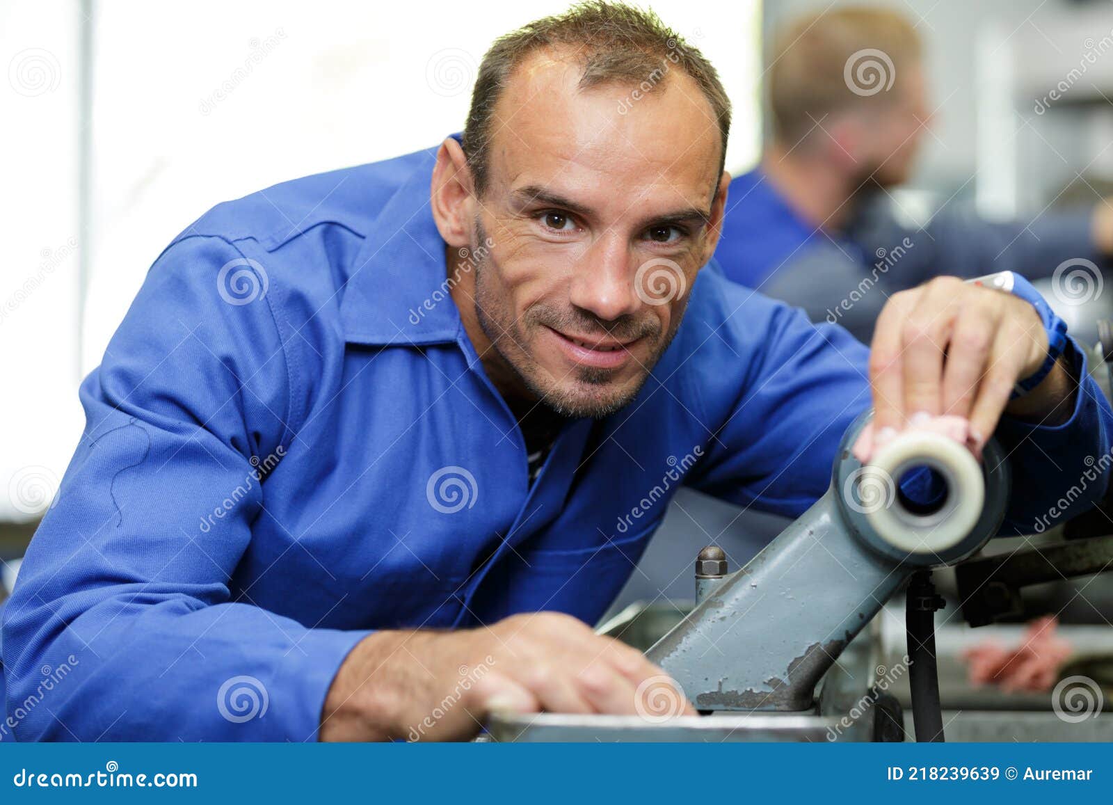 Male Industrial Worker Puts A Gas Cylinder Into A Gas Machine ...