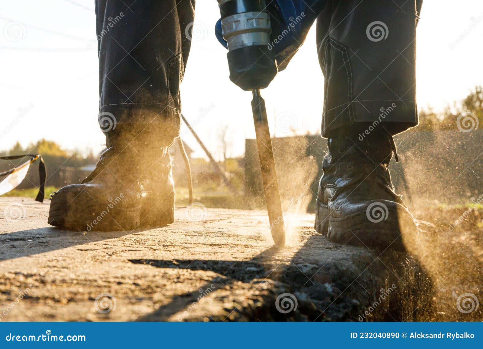 A Male Installer Works with a Hammer Drill. Construction Works. Stock ...